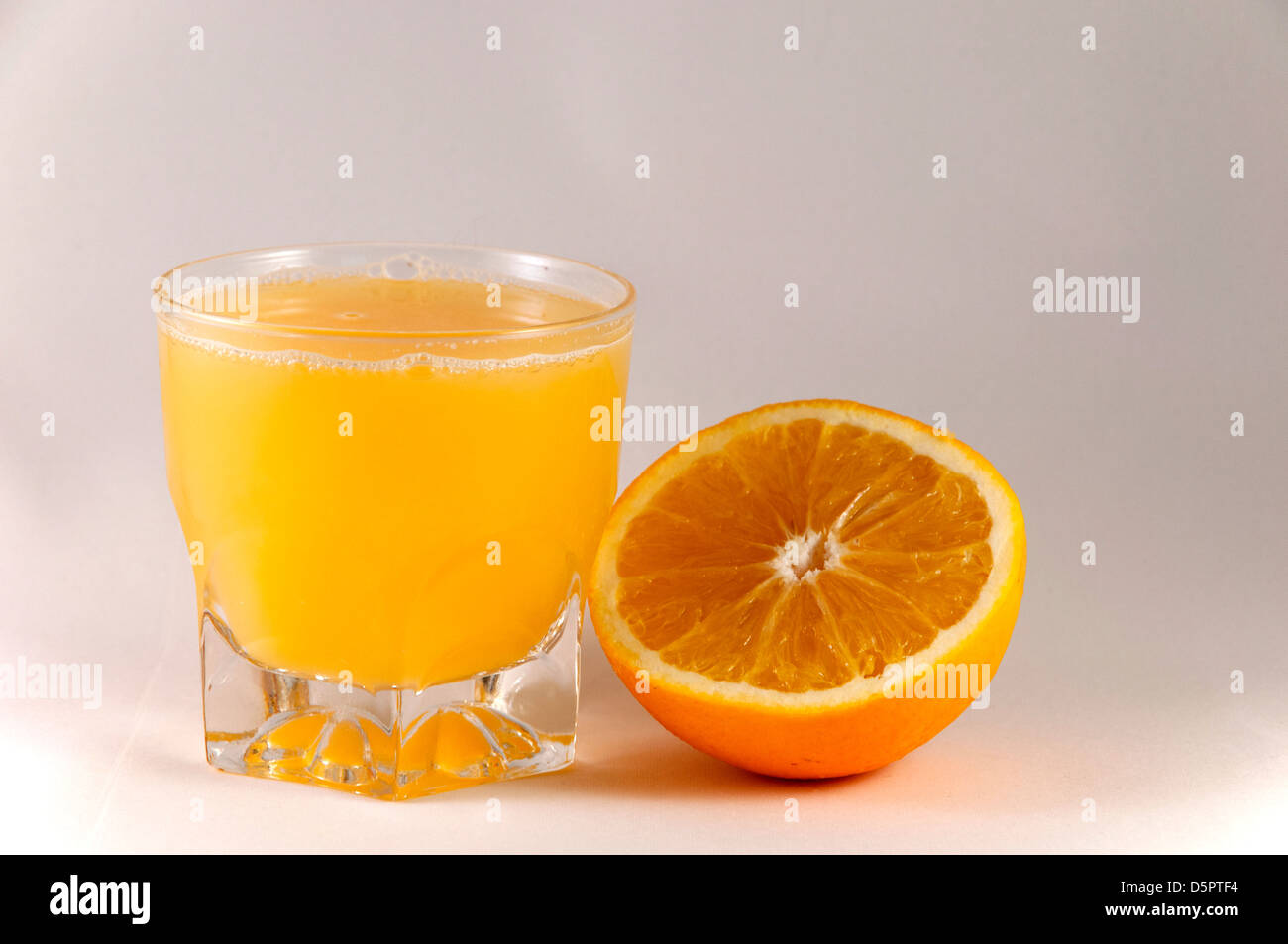 orange juice with orange glass and cut Stock Photo - Alamy