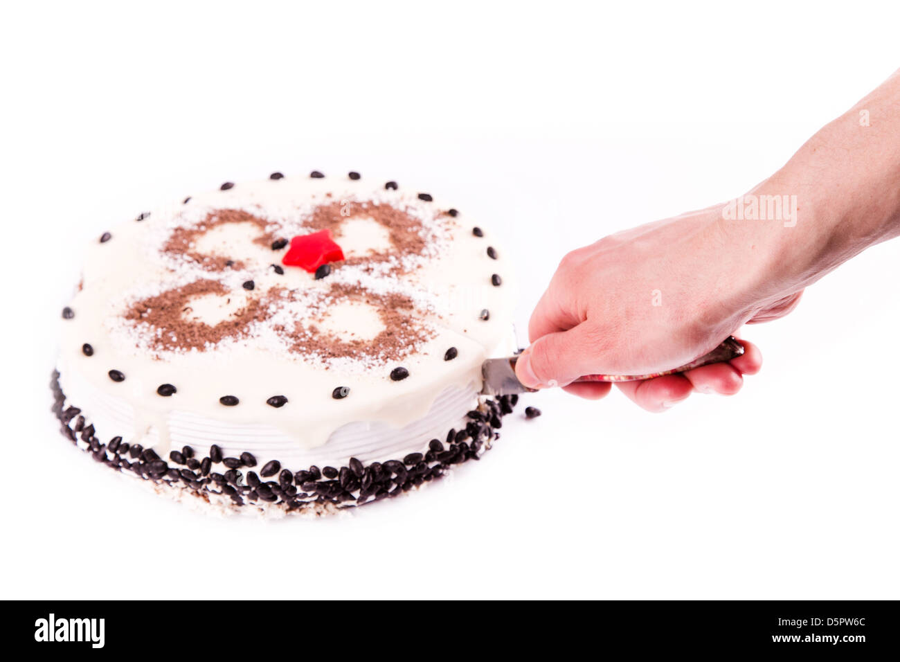 Male hand cutting a piece of tasty coffee chocolate cake isolated on ...