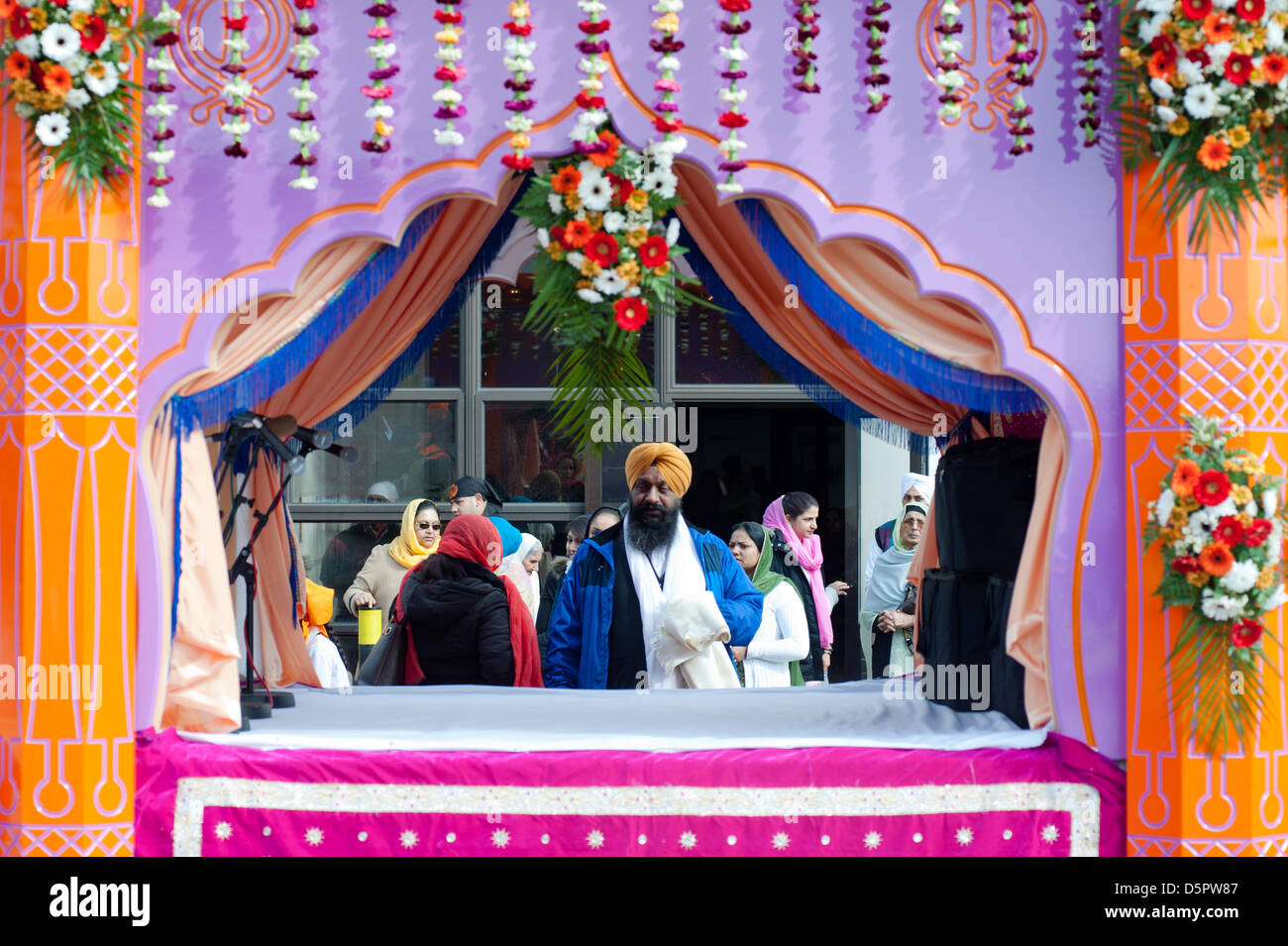 London, UK. 7th April 2013. A Sikh man stands behind the float used for ...