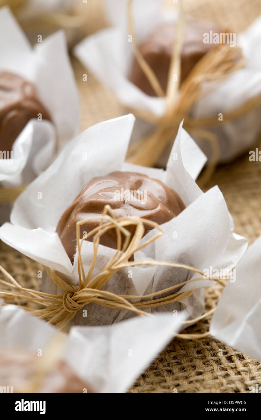 Milk chocolate in white wrapping Stock Photo - Alamy