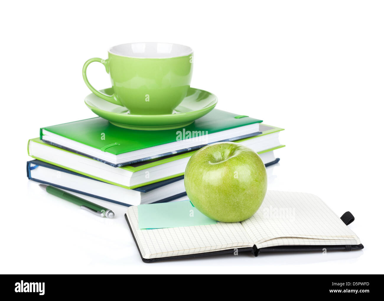 Ripe green apple, coffee cup and office supplies. Isolated on white ...