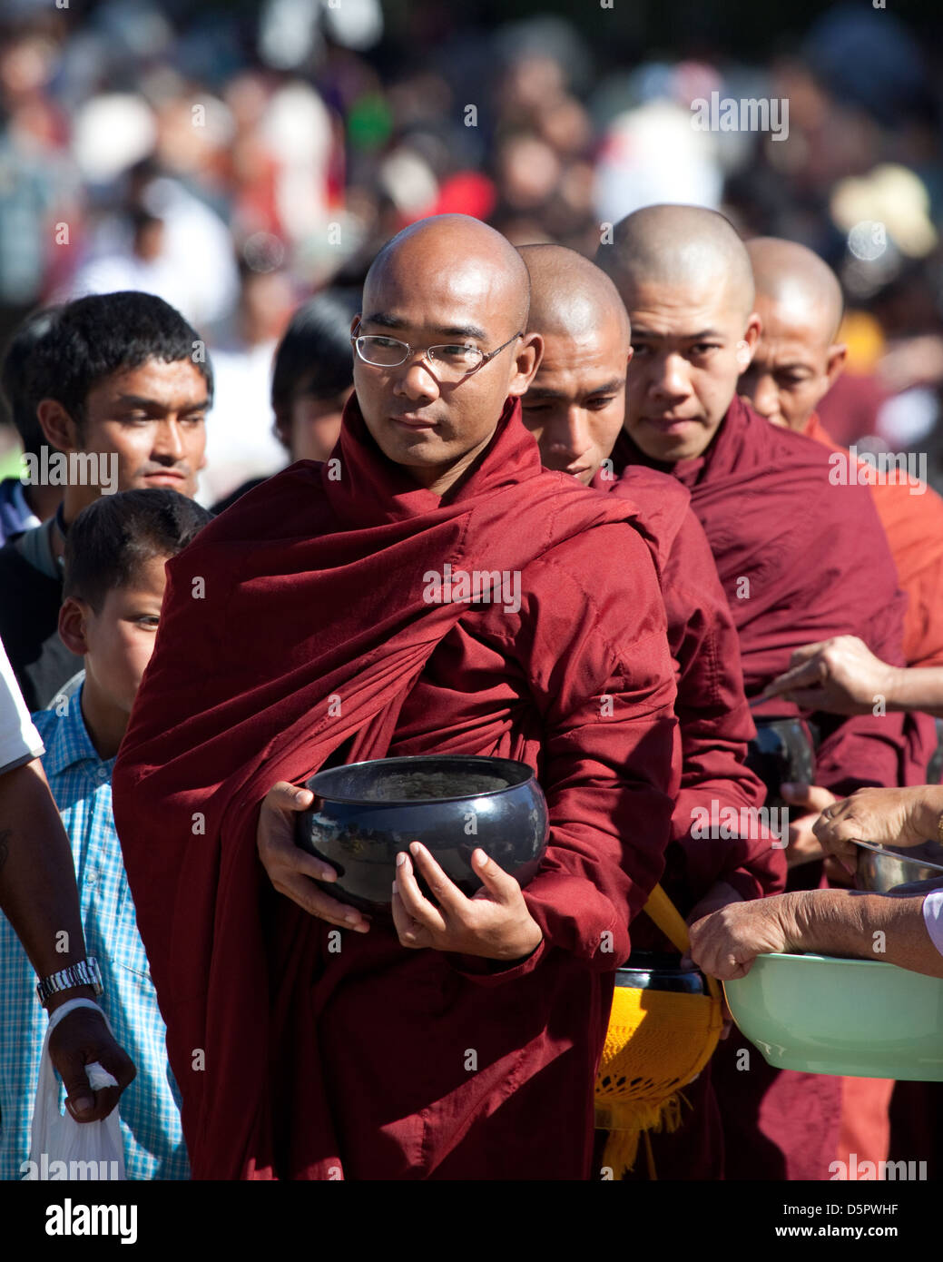 Burmese monks collecting their alms Stock Photo - Alamy