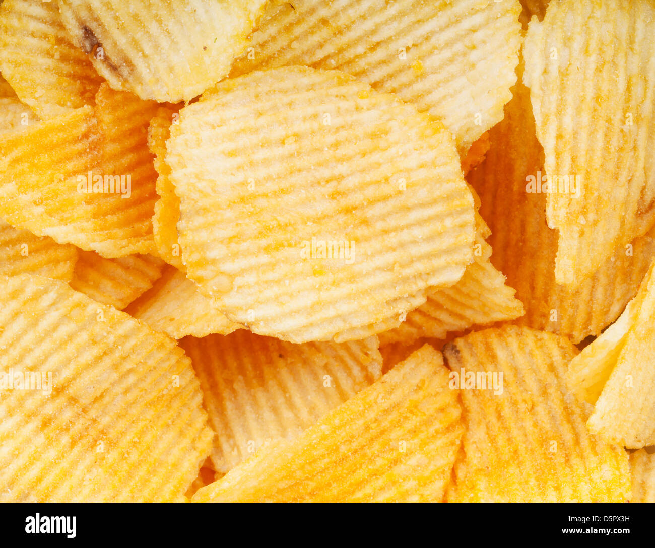 Heap of potato chips closeup Stock Photo - Alamy