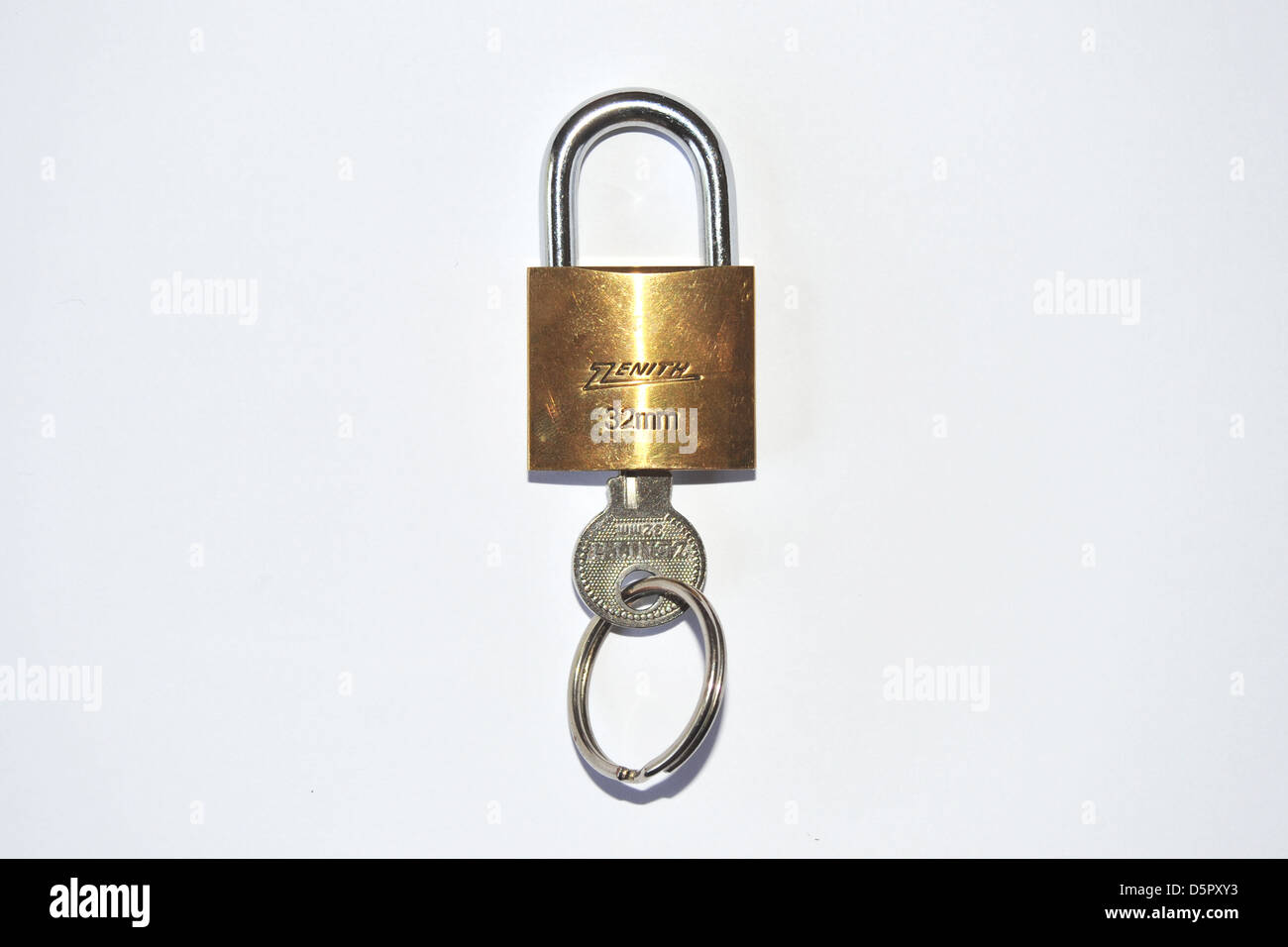 A locked Zenith padlock and key photographed in a studio Stock Photo ...