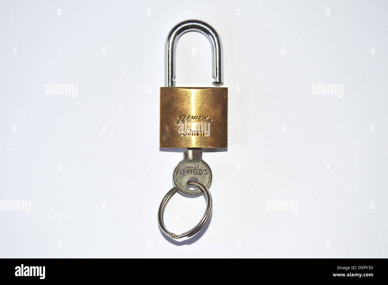A locked Zenith padlock and key photographed in a studio Stock Photo ...