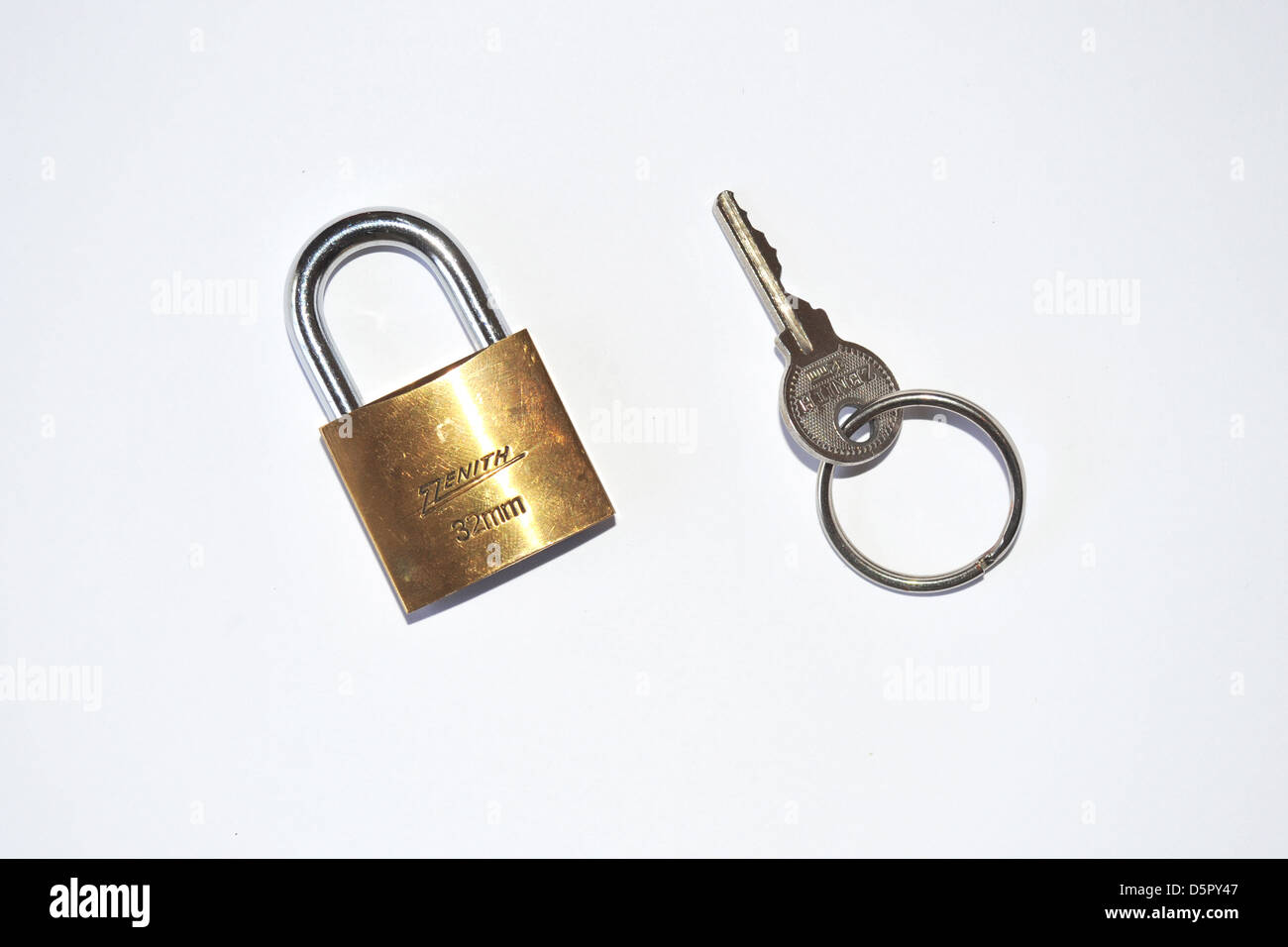 A locked Zenith padlock and key photographed in a studio Stock Photo ...
