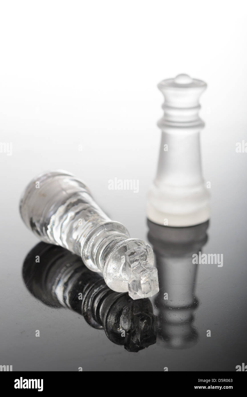 Check mate Glass chess pieces with queen over king Stock Photo - Alamy