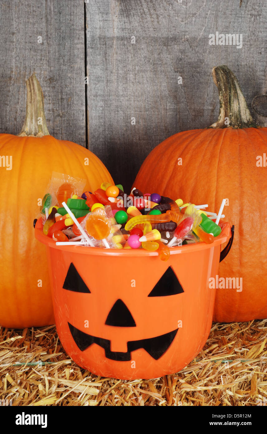 candy filled halloween pumpkin bucket Stock Photo - Alamy