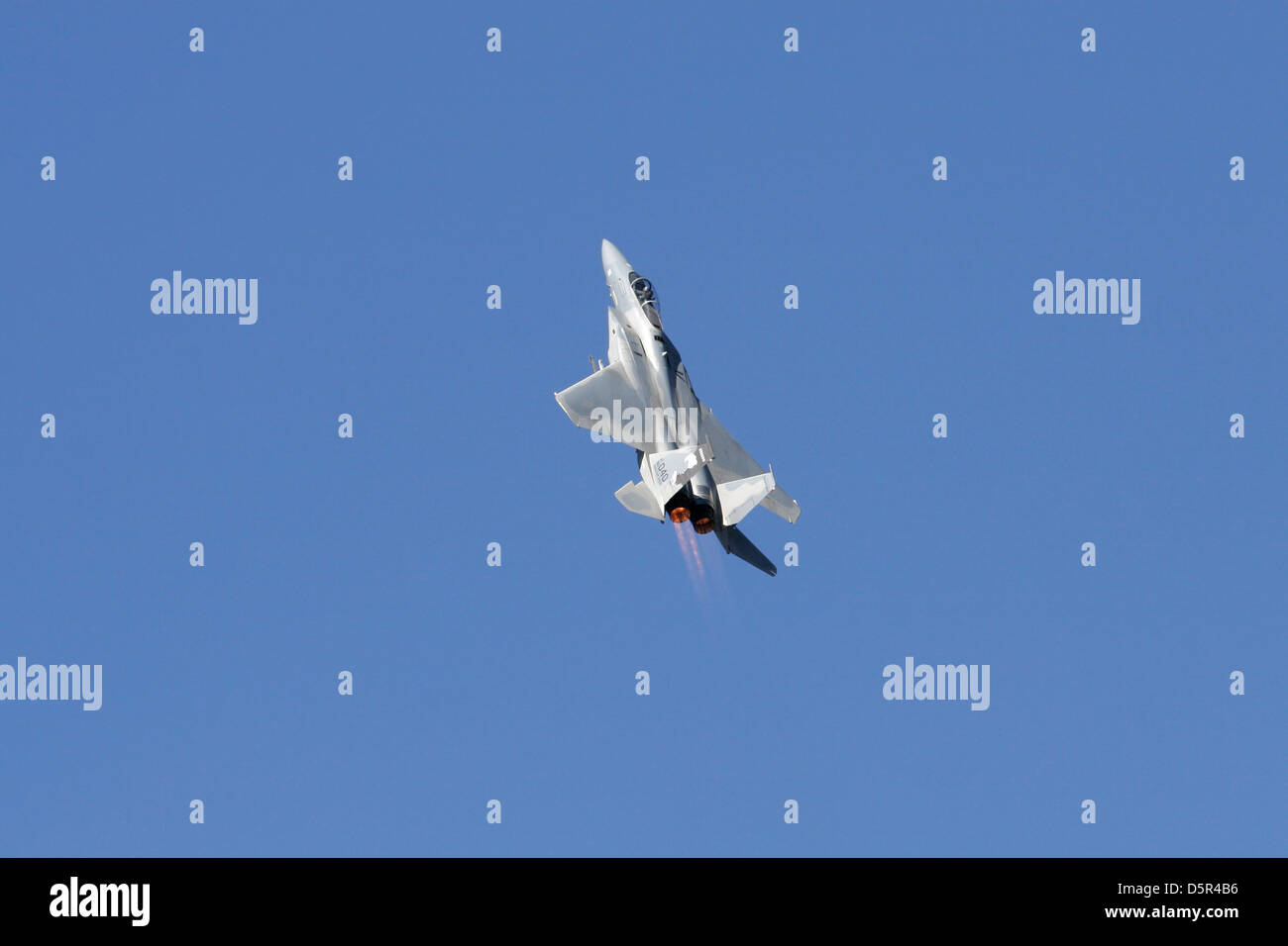 F-15 Military Jet in a climb with afterburners shooting flames Stock ...