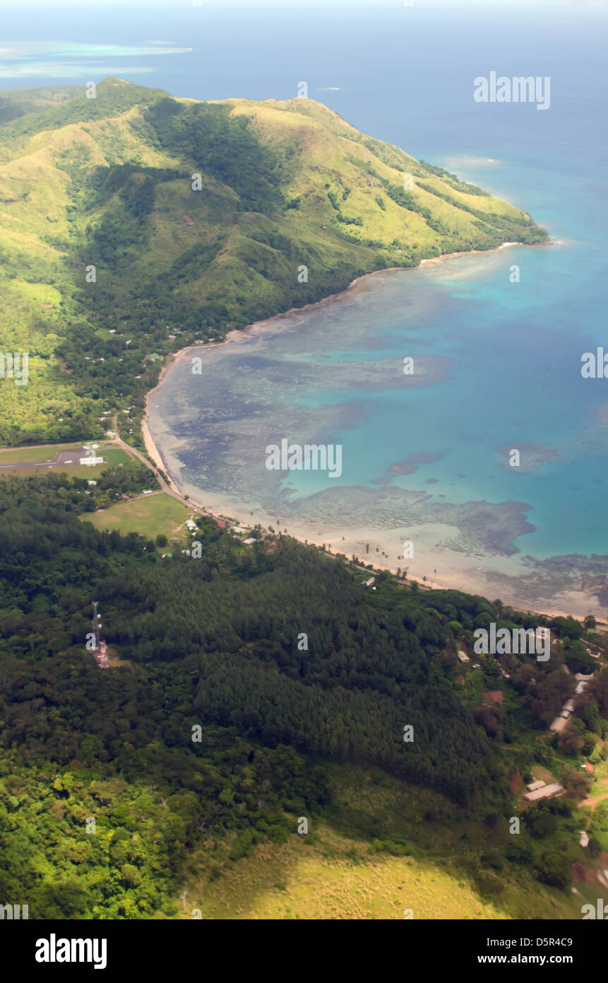 A turquoise bay lined with beaches and bright green jungle, Kadavu ...