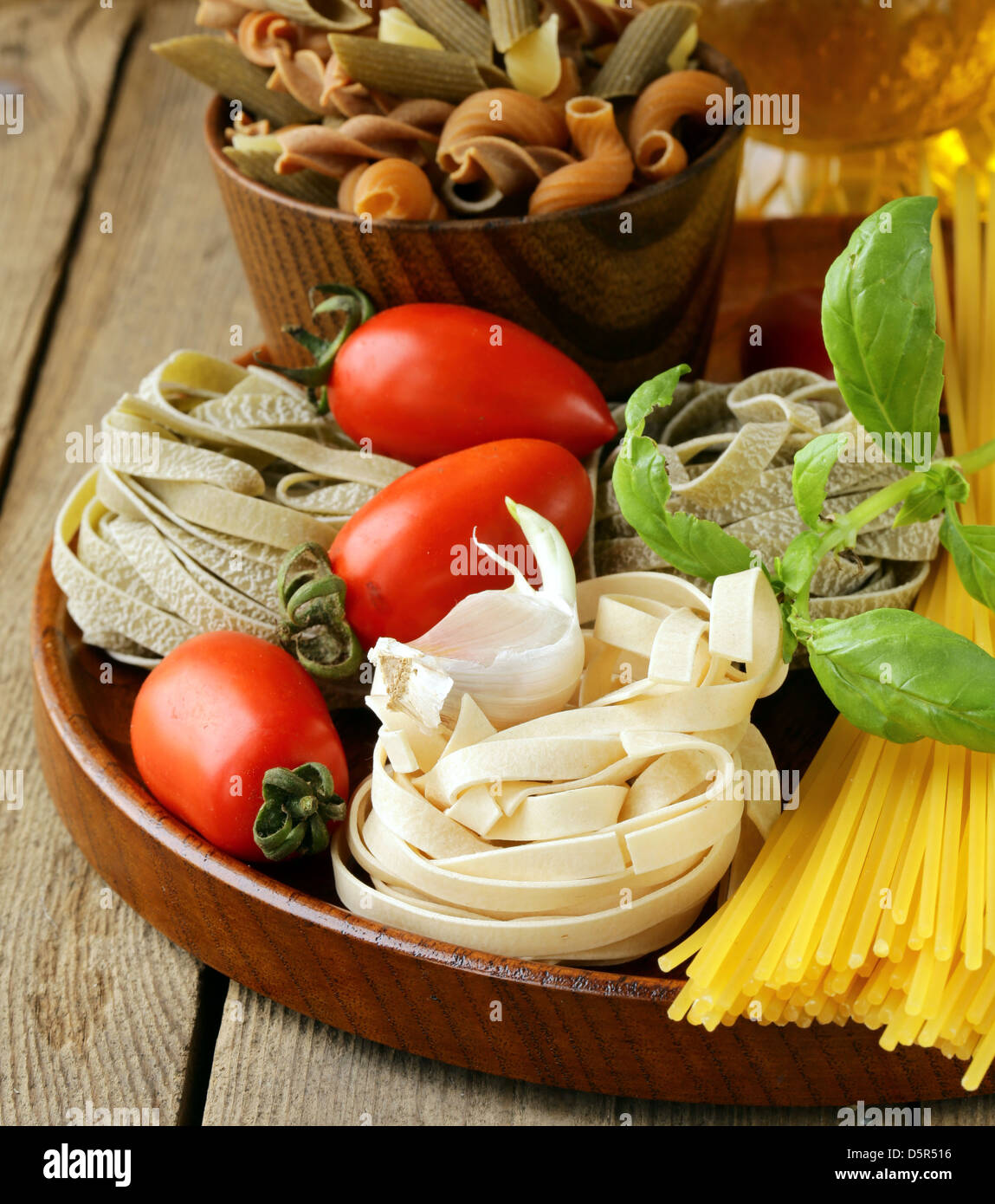 Various types of pasta (spaghetti, fettuccini, penne) and tomato Stock ...