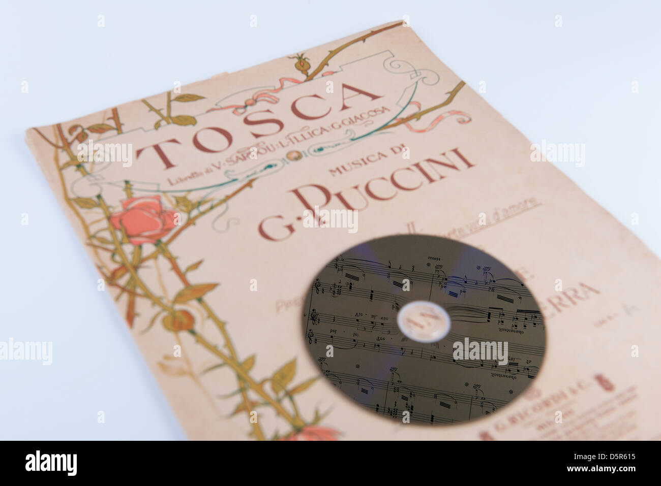 compact disc with a sheet music and notes reflection Stock Photo - Alamy