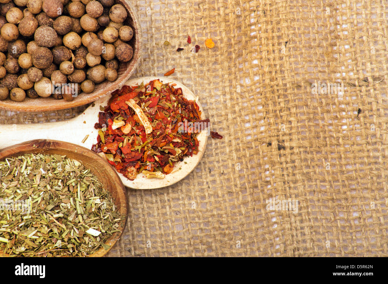 Colorful spices on burlap Stock Photo - Alamy
