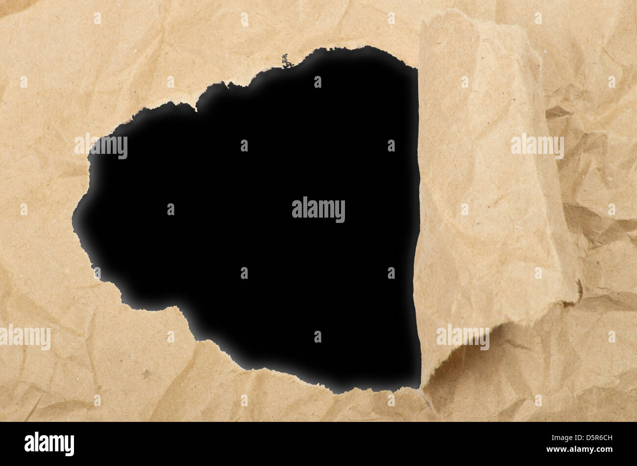 ripped white paper against a black background Stock Photo - Alamy