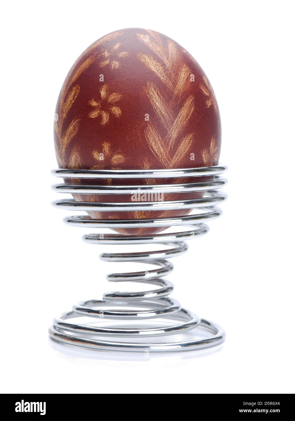 Soft-boiled egg with Easter ornament egg-shell in a spiral stand shot ...