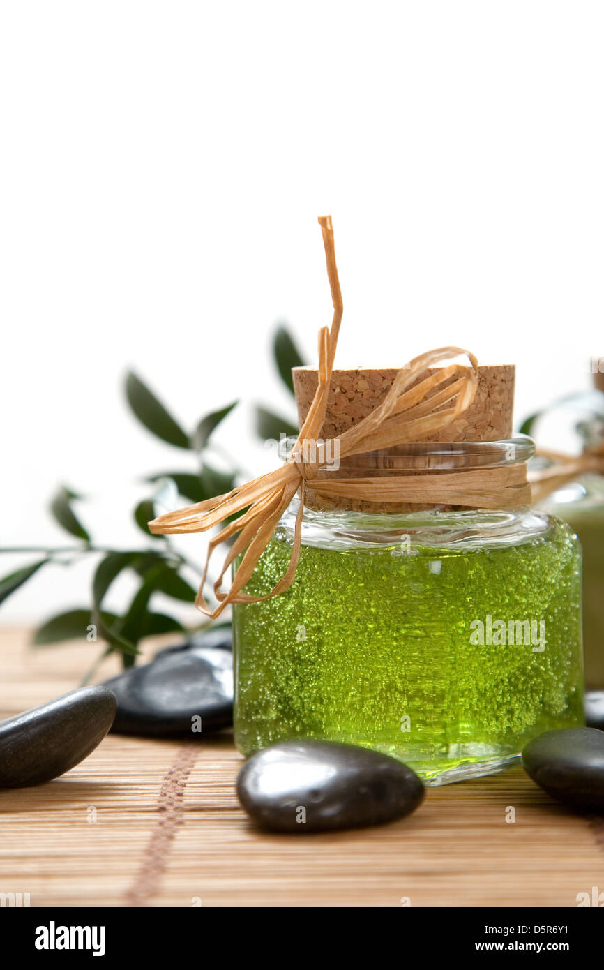 Green color bath salt and liquid soap Stock Photo - Alamy