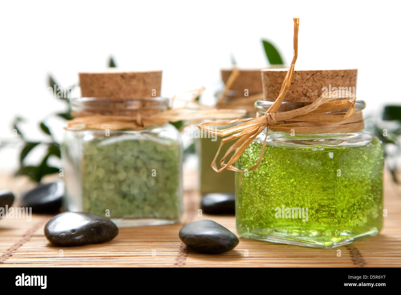 Green color bath salt and liquid soap Stock Photo - Alamy