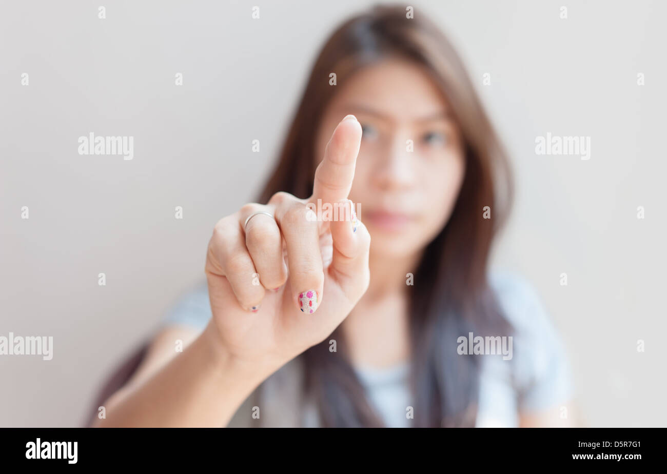 asian woman pressing an imaginary button empty space for buttons Stock ...
