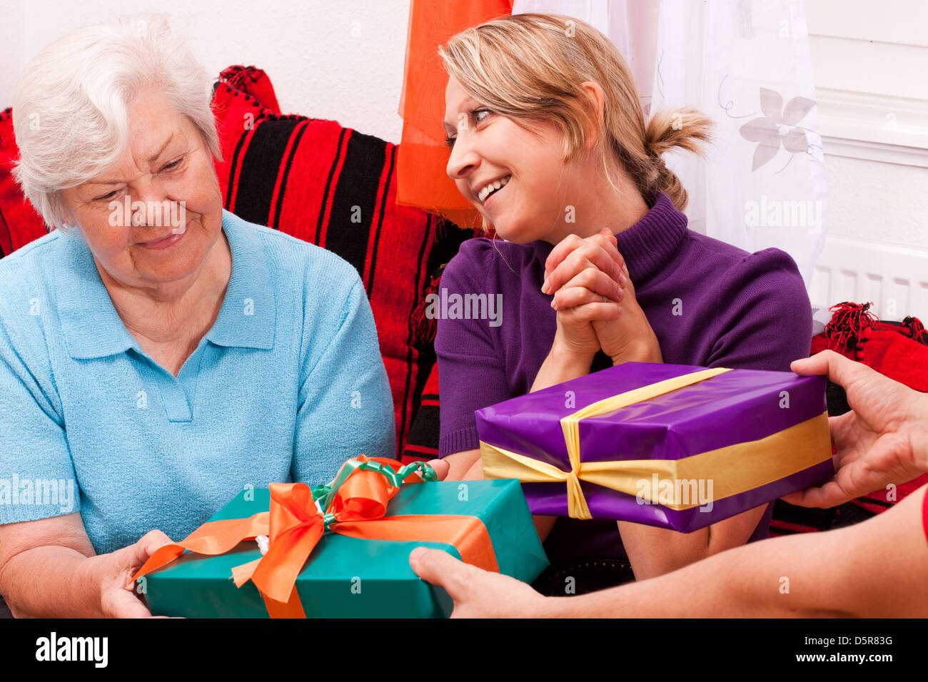 two different old women gets a lot of gifts Stock Photo - Alamy