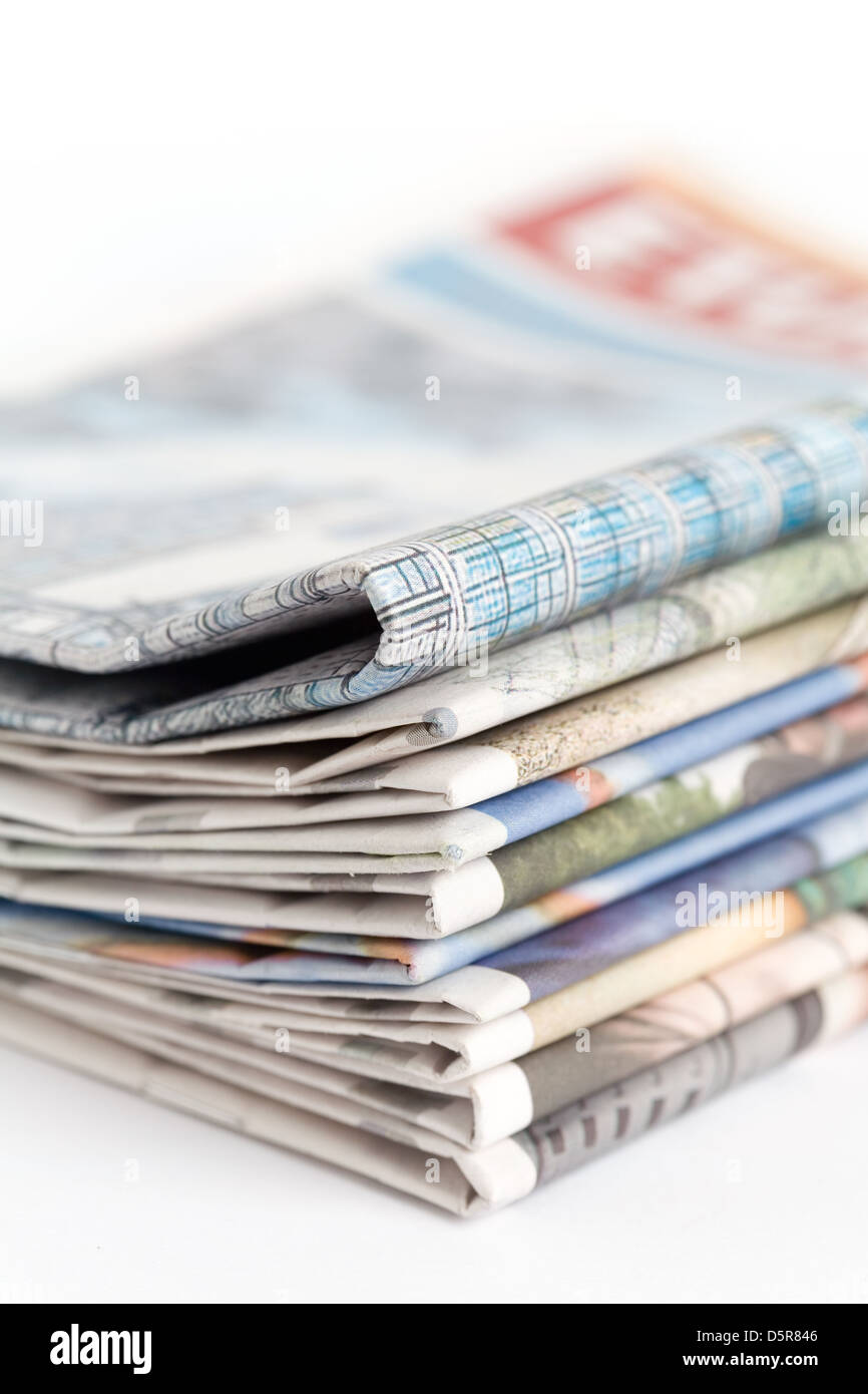 Stack of newspapers on white background Stock Photo - Alamy