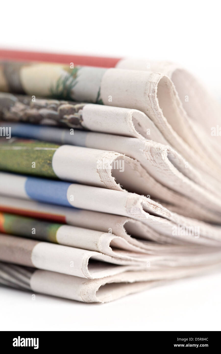 Stack of newspapers on white background Stock Photo - Alamy