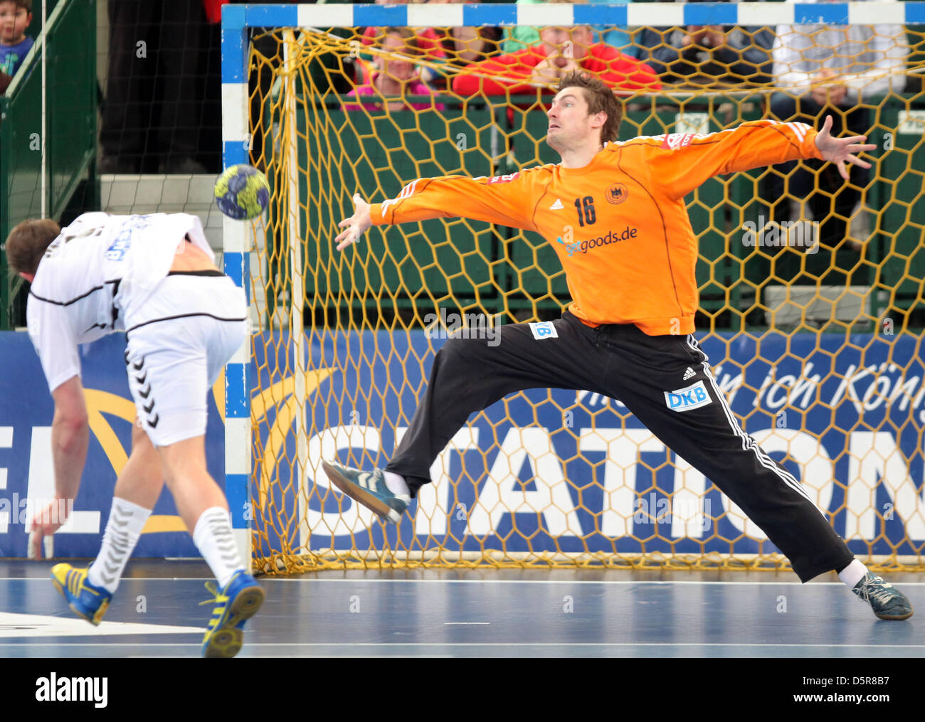 German goalkeeper Carsten Lichtlein (R) tries to stop the penalty throw ...