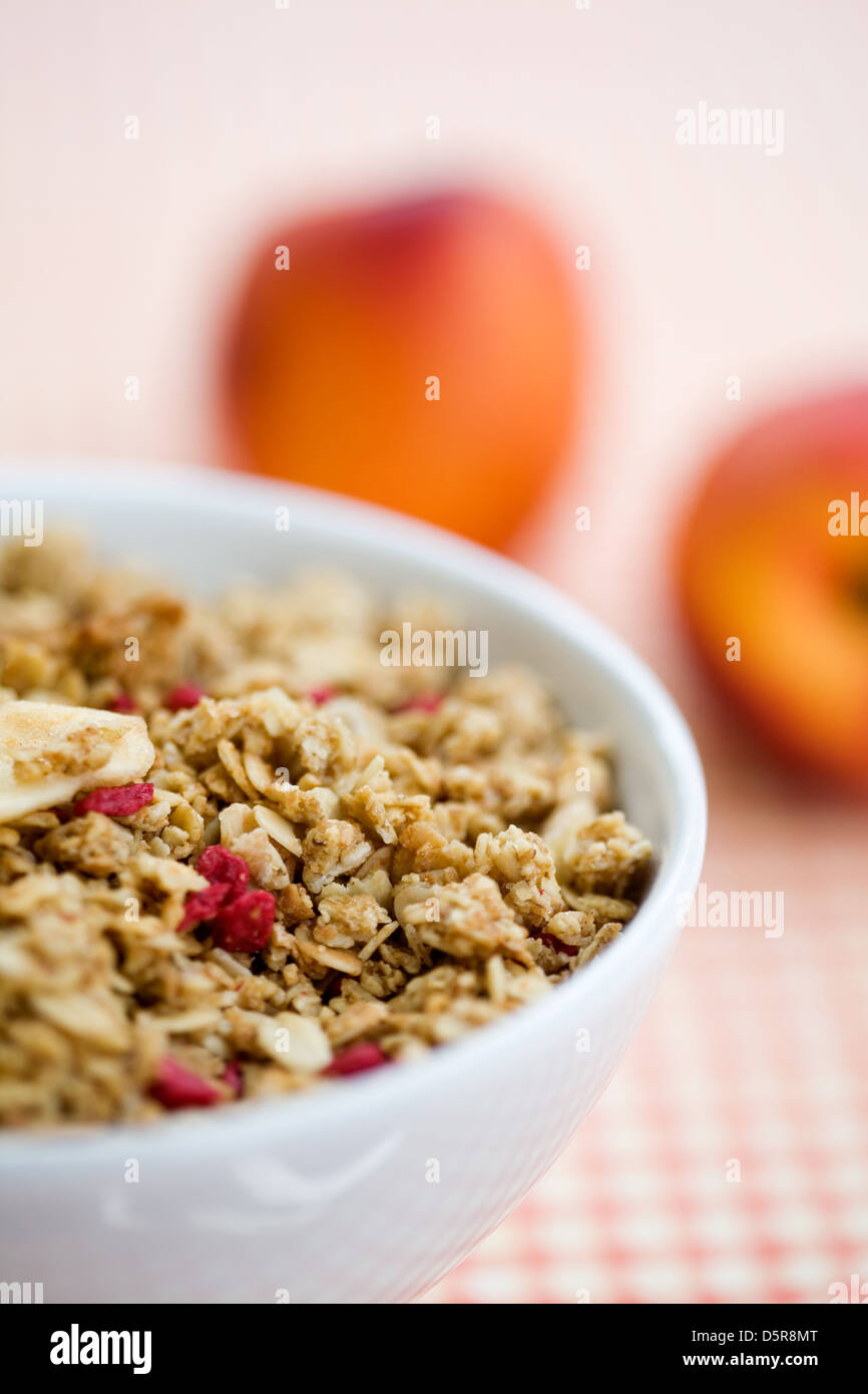 Breakfast cereal with dryed fruits and fresh peaches Stock Photo - Alamy