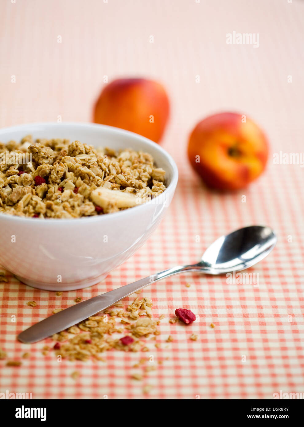 Breakfast cereal with dryed fruits and fresh peaches Stock Photo - Alamy
