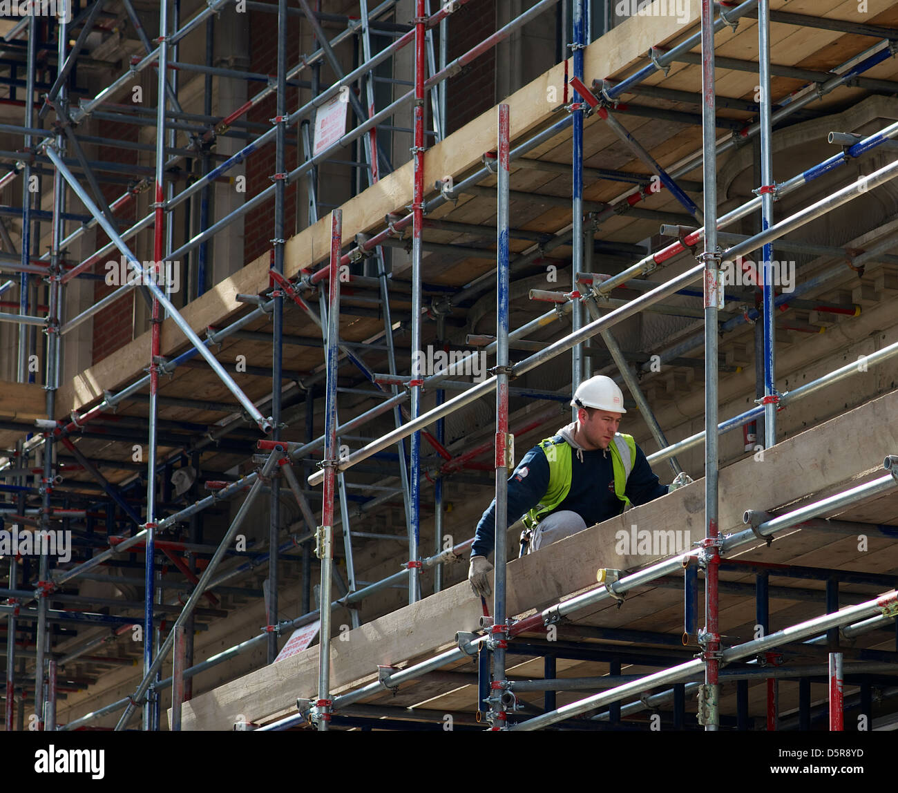 Builder on Scaffolding in London Stock Photo - Alamy