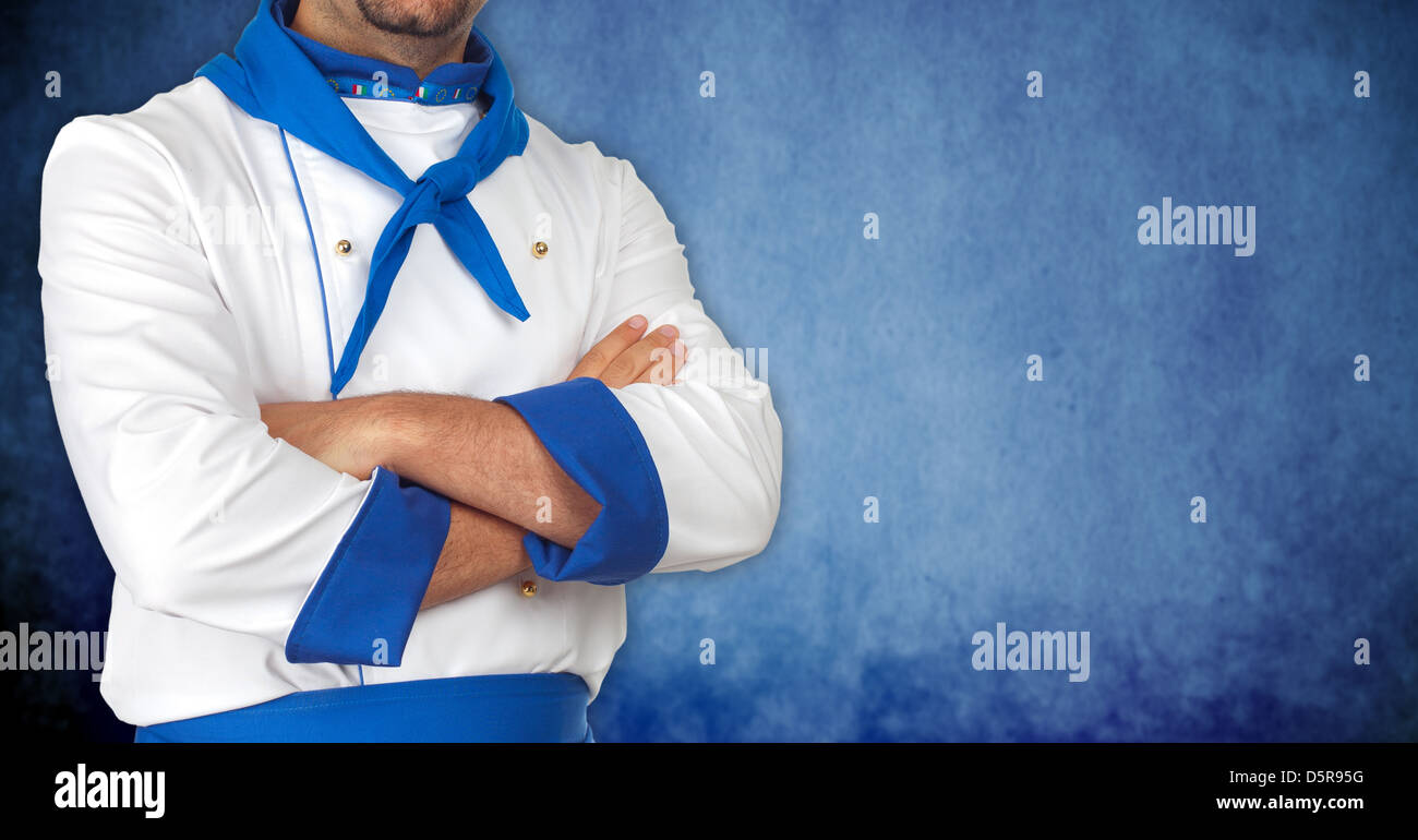 Young chef on blue background Stock Photo - Alamy