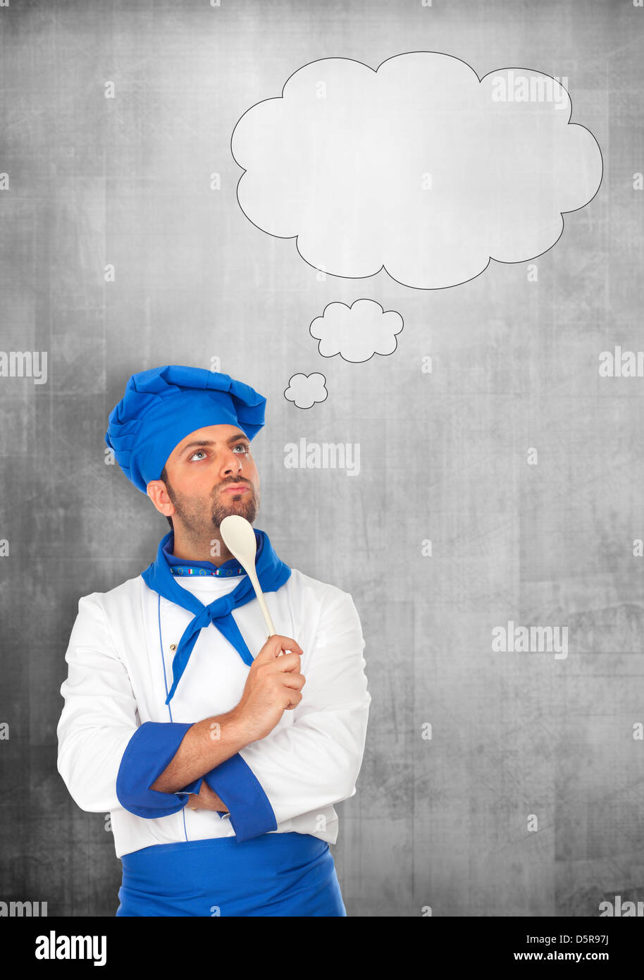 Young chef think on gray background Stock Photo - Alamy