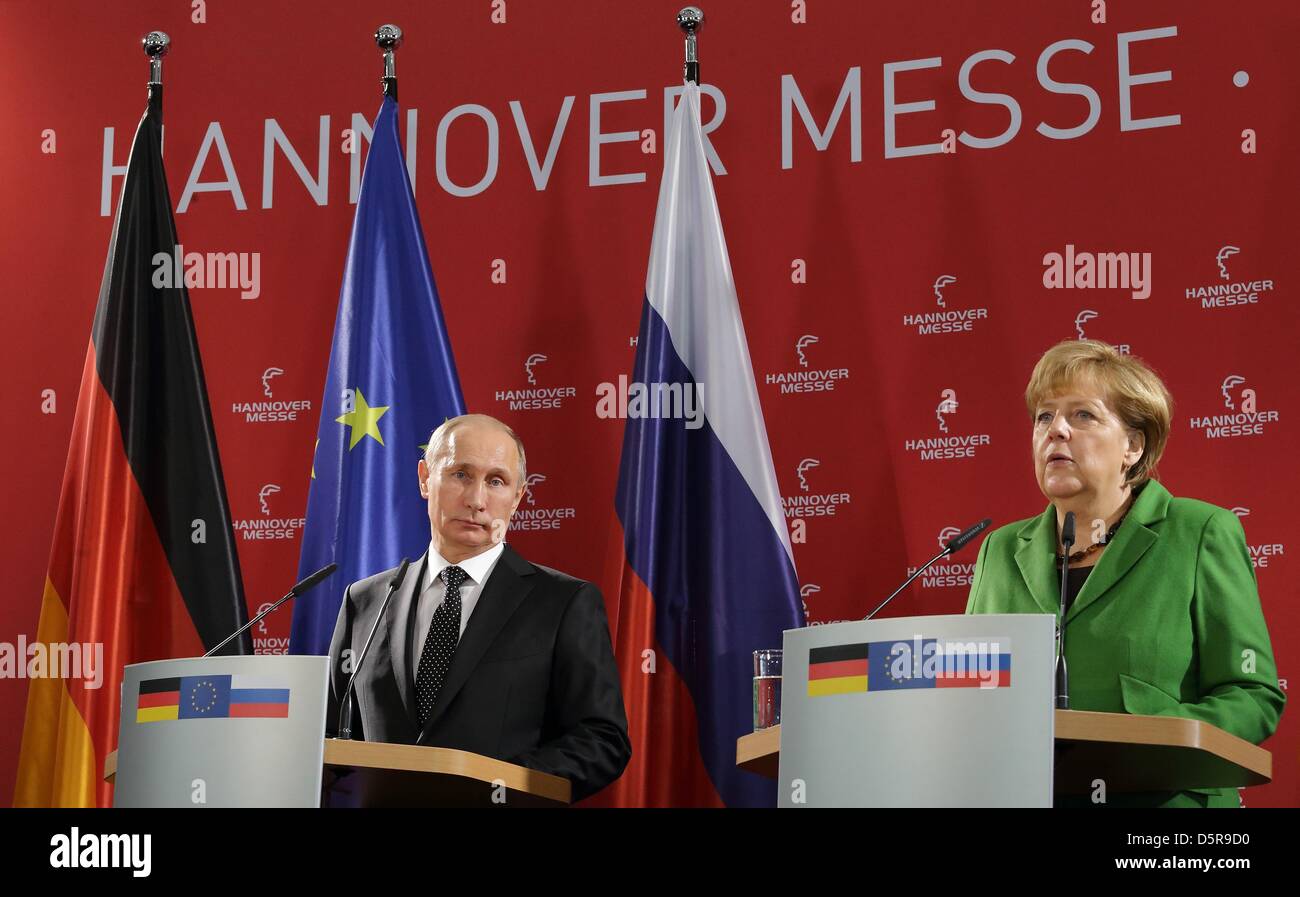 German Chancellor Angela Merkel (R) and Russian President Vladimir ...