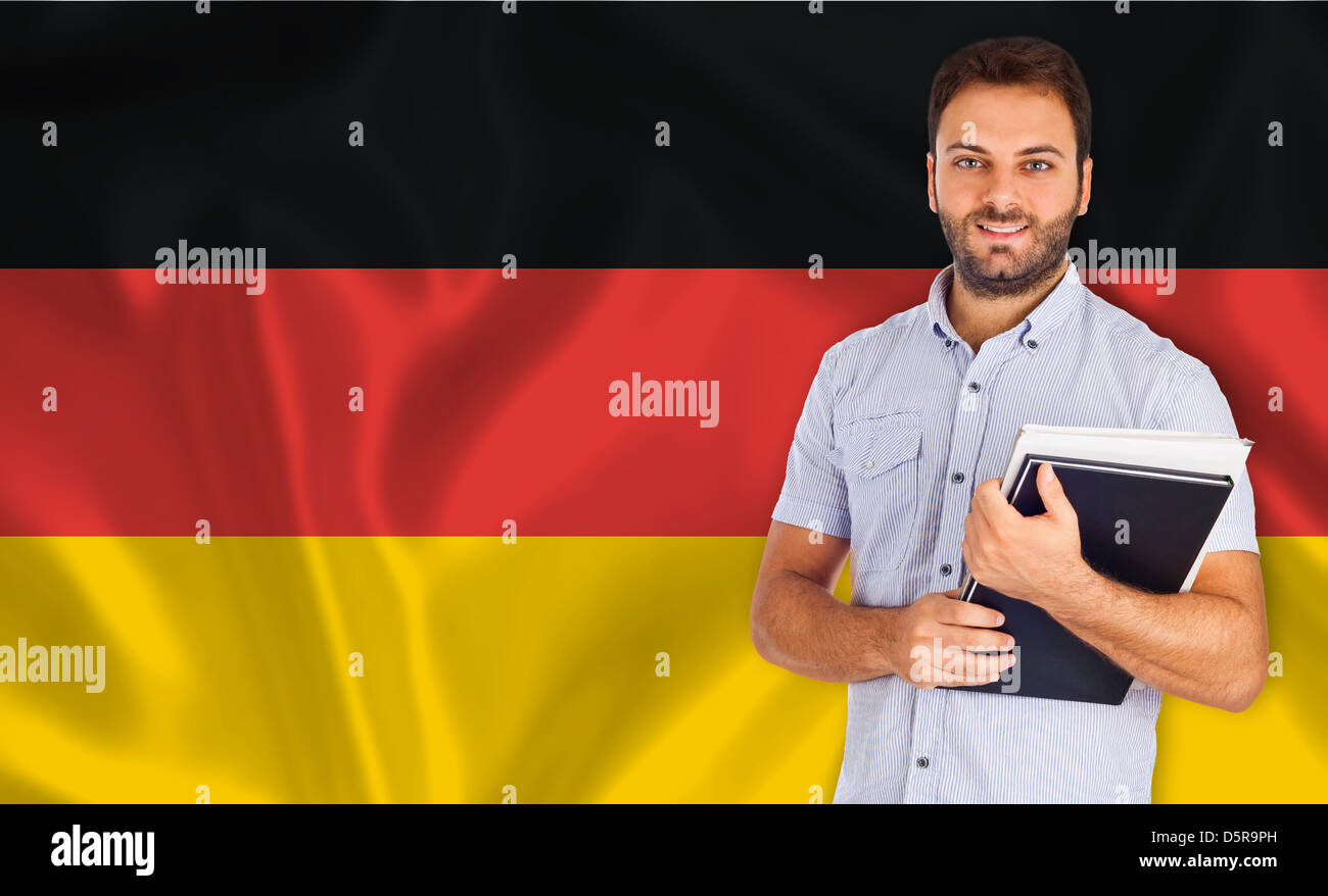 Young smiling student learns the germany language Stock Photo - Alamy