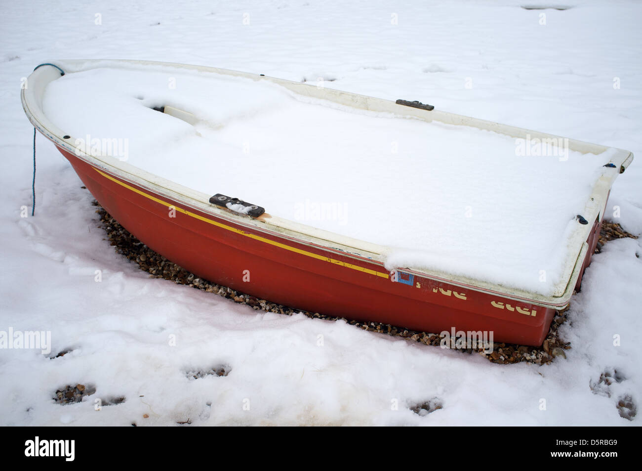 Boat full of snow Stock Photo - Alamy