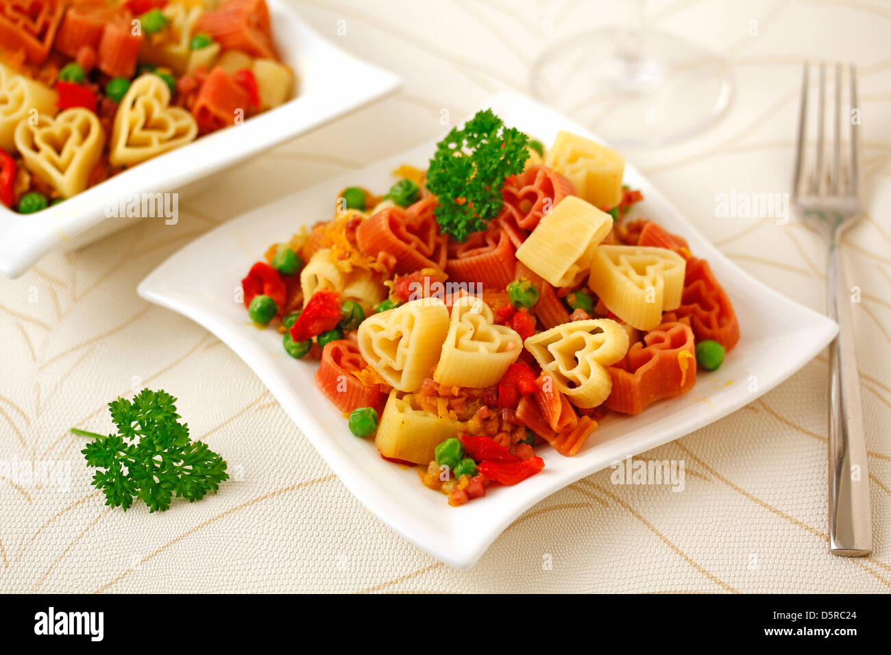 Heart shaped pasta with curry. Recipe available Stock Photo - Alamy