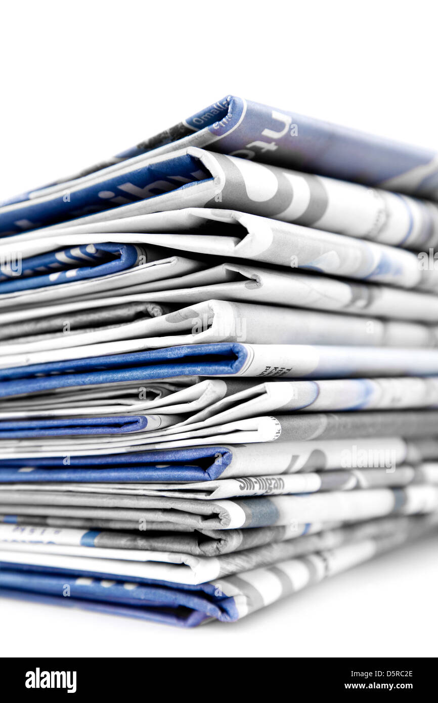 Stack of newspapers on white background Stock Photo - Alamy