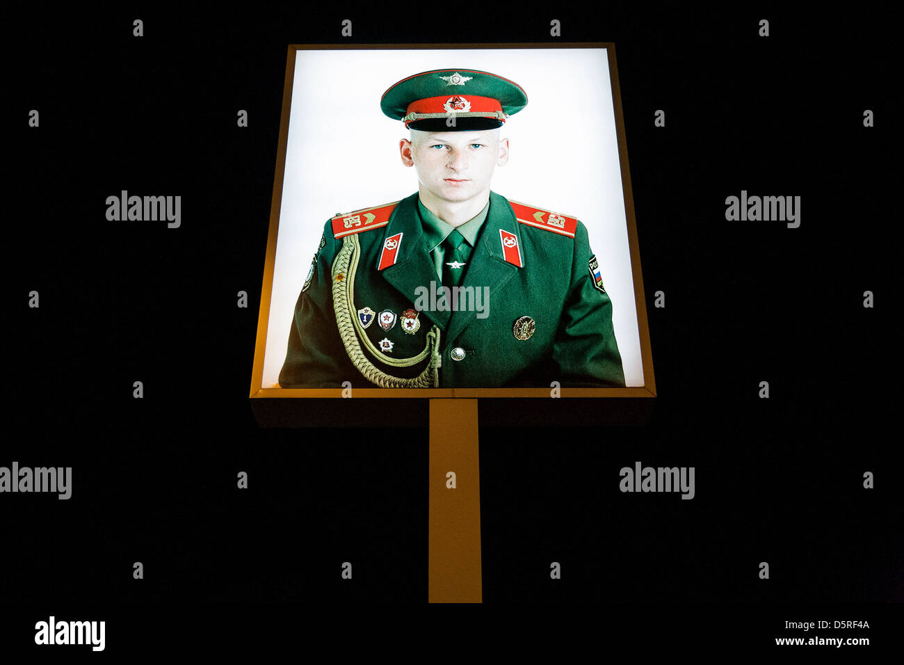 A mast with an image of a Soviet soldier, Checkpoint Charlie, Berlin ...