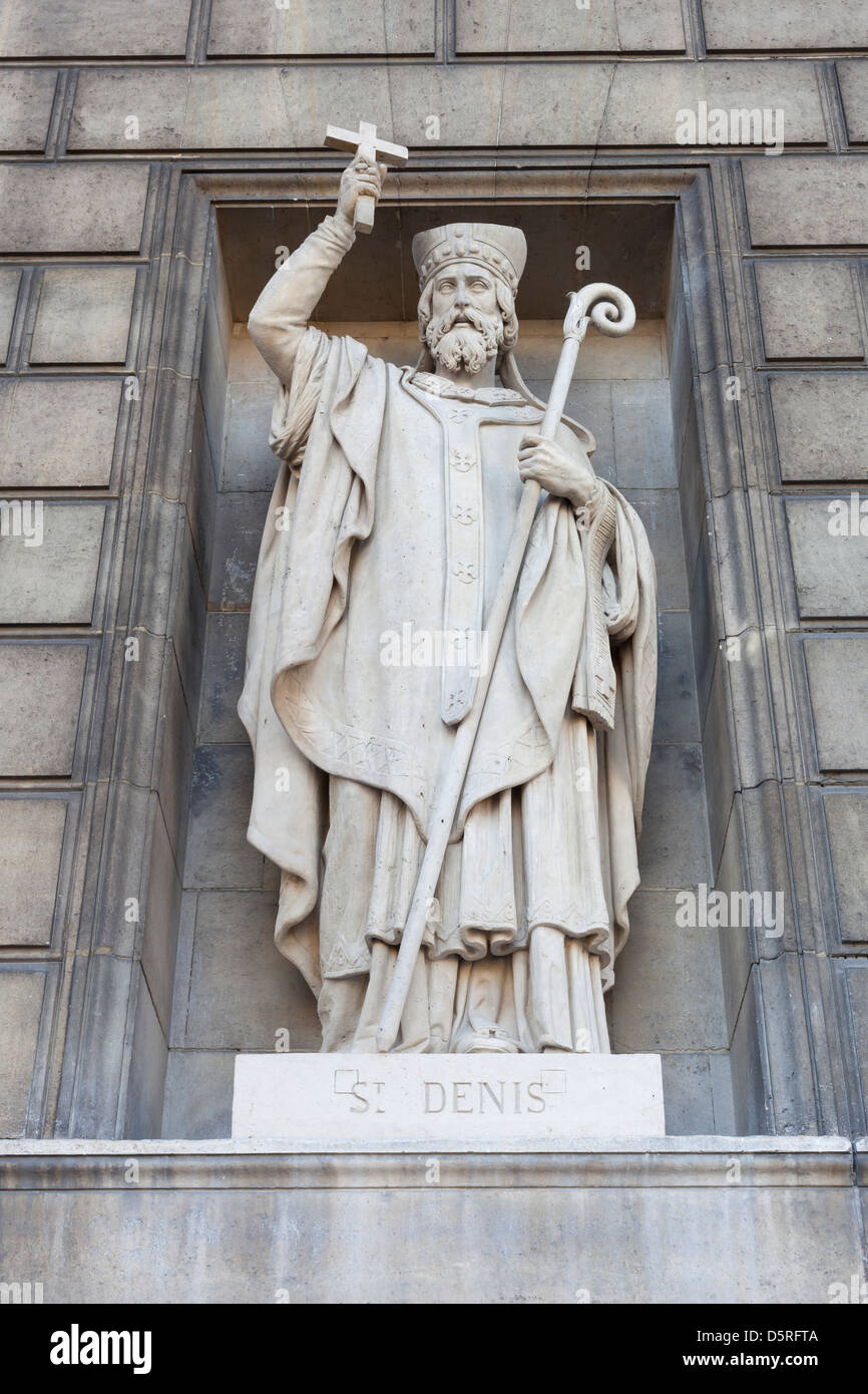 Statue of Saint Denis outside La Madeleine Church, Paris, France ...