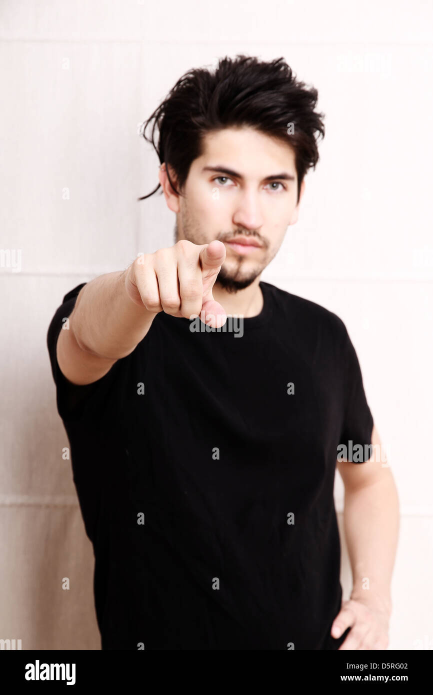 A young man pointing at you. Focus on Finger Stock Photo - Alamy