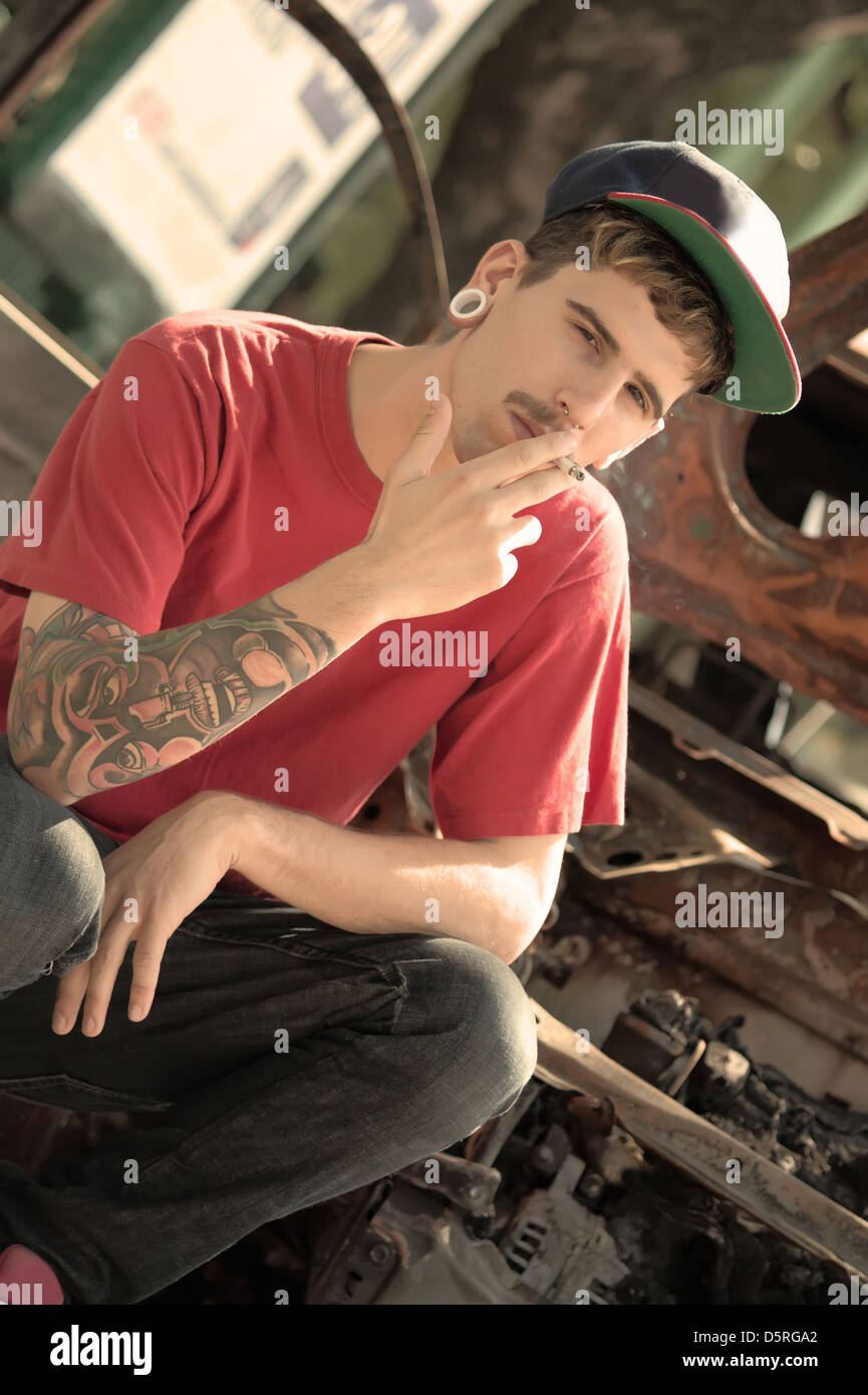 A young Rapper smoking a cigarette Stock Photo - Alamy
