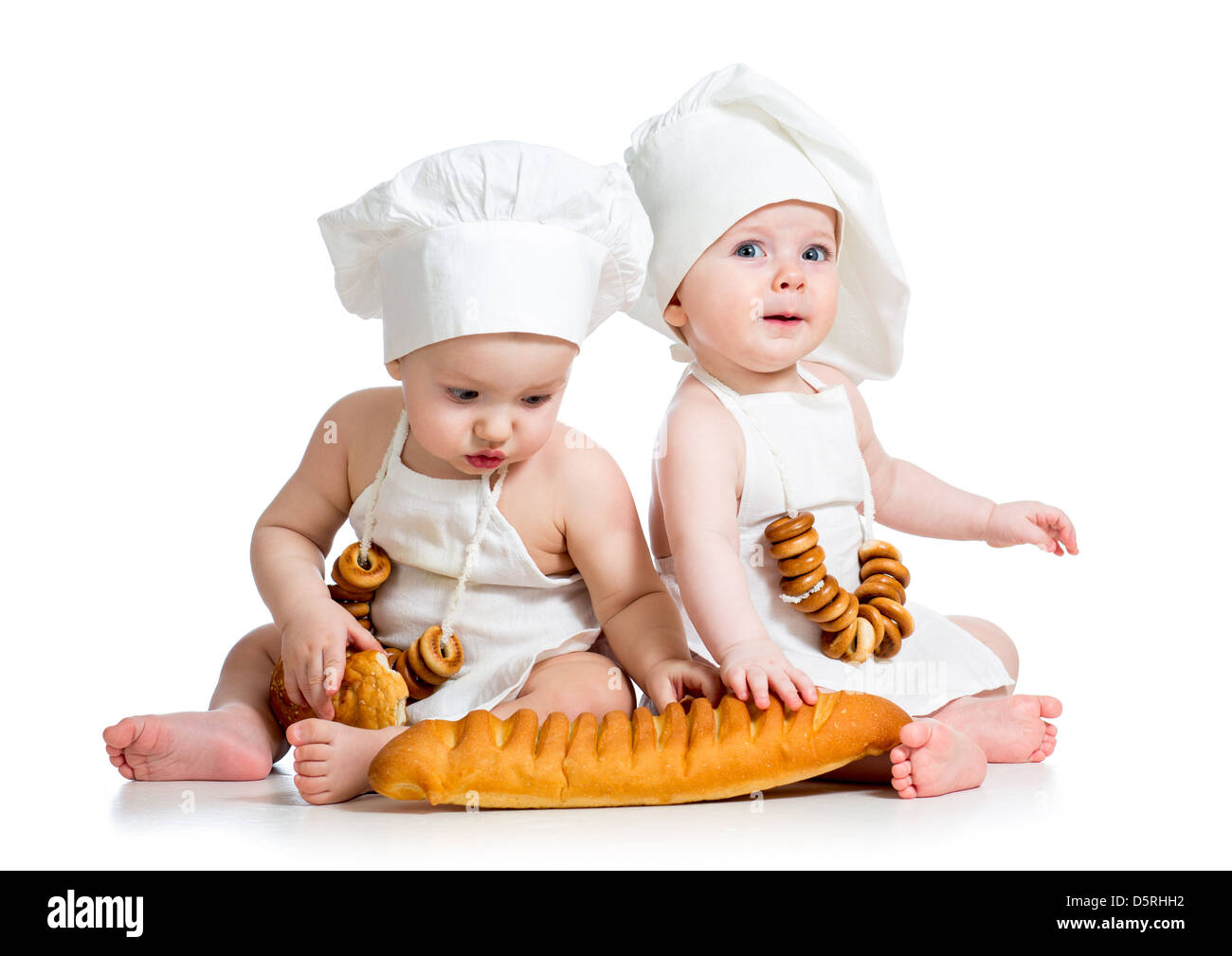 Little bakers kids boy and girl Stock Photo - Alamy