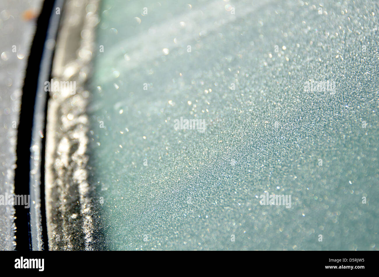 Frost glitters on a frozen windshield Stock Photo - Alamy
