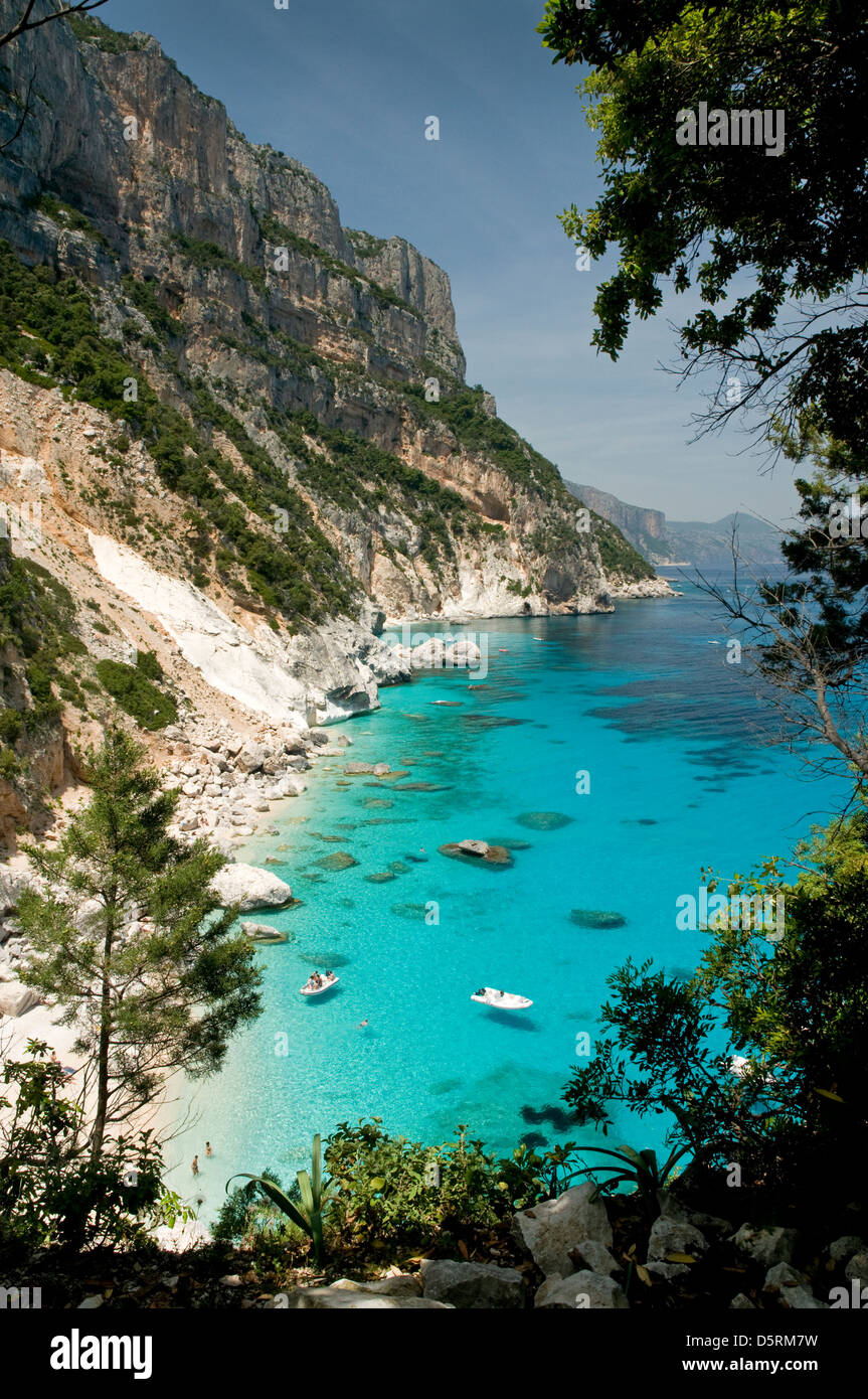 Clear turquoise waters of the sea and the white limestone rocks at Cala ...