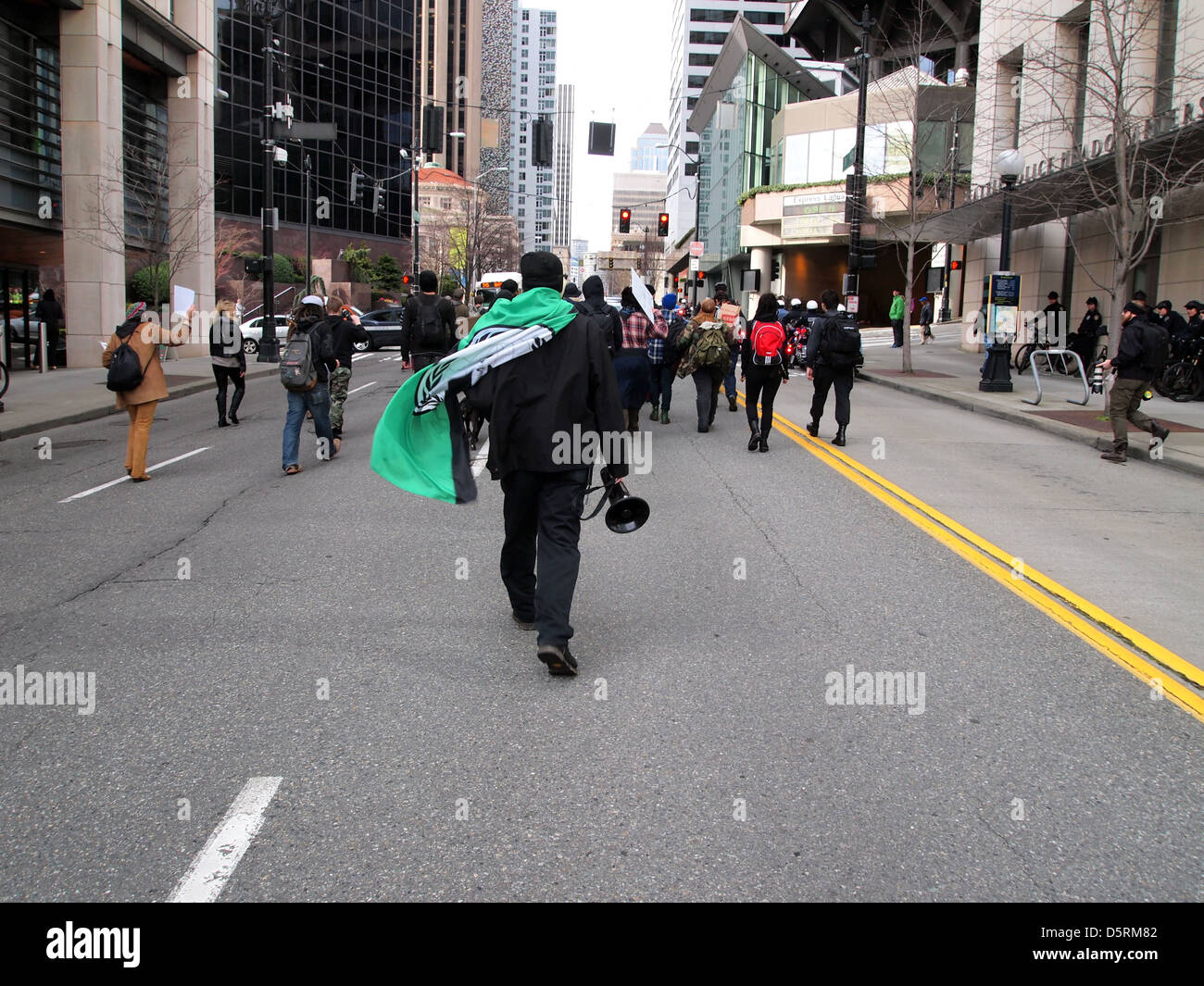 Protestors march past the Seattle Police Department Headquarters during ...
