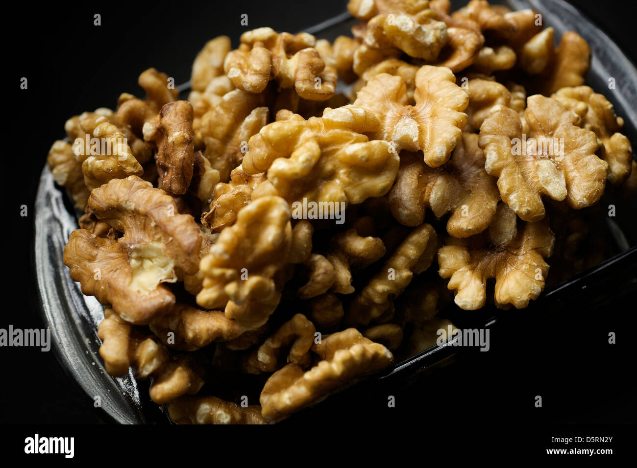 Walnuts, shell removed, in a glass container Stock Photo - Alamy