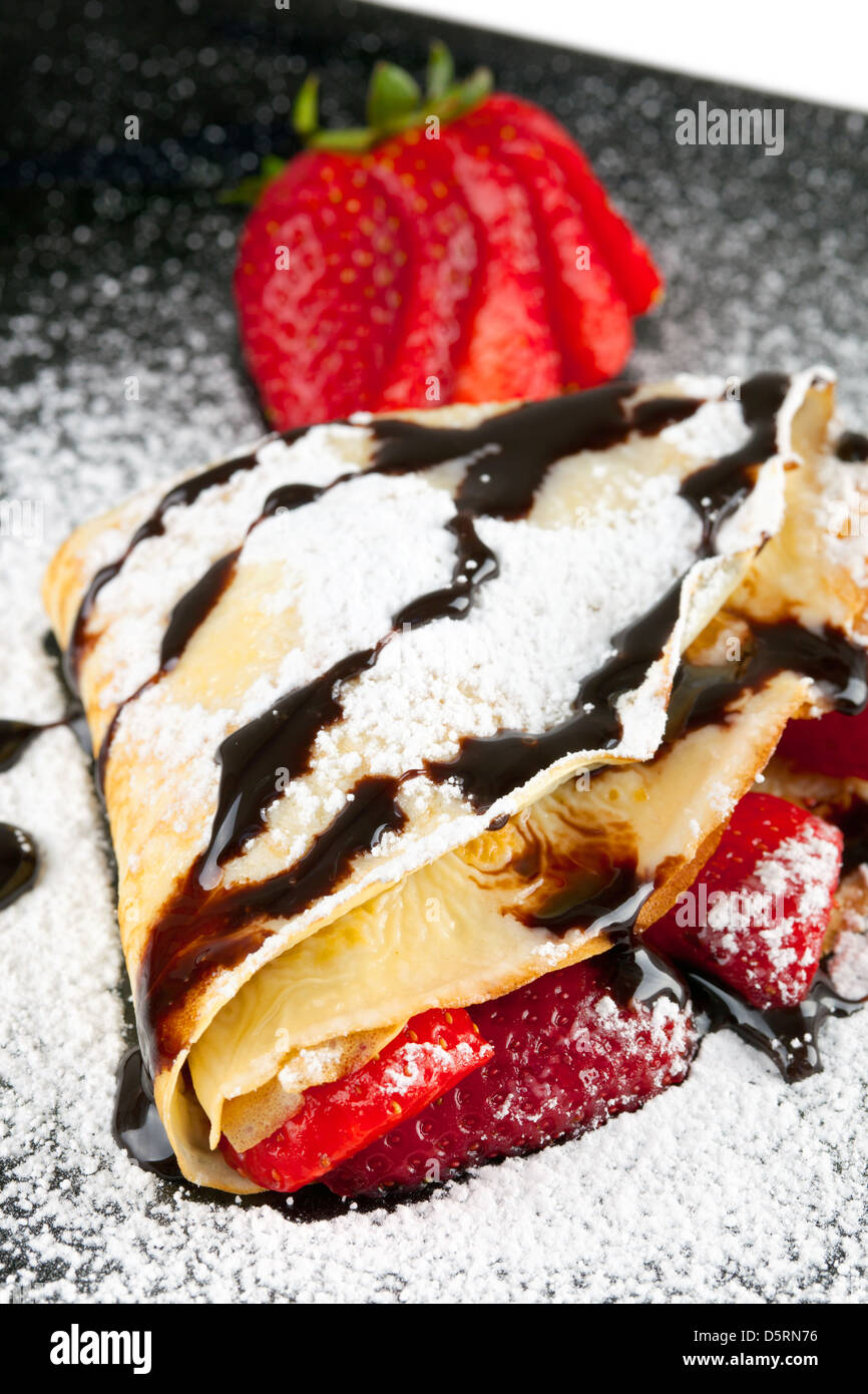 Strawberry Crepe with Chocolate syrup Stock Photo - Alamy