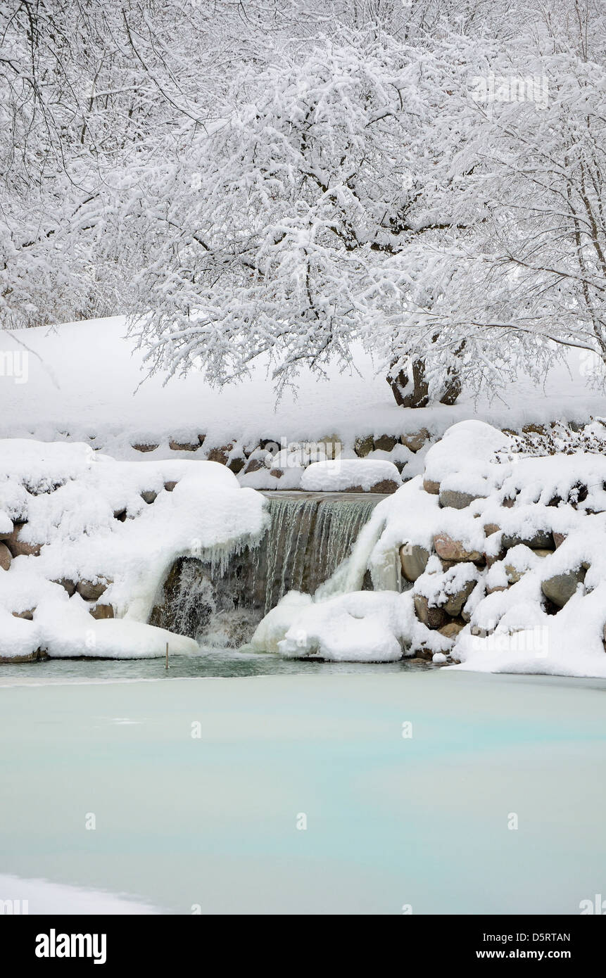 Snow covered waterfall and pond Stock Photo - Alamy