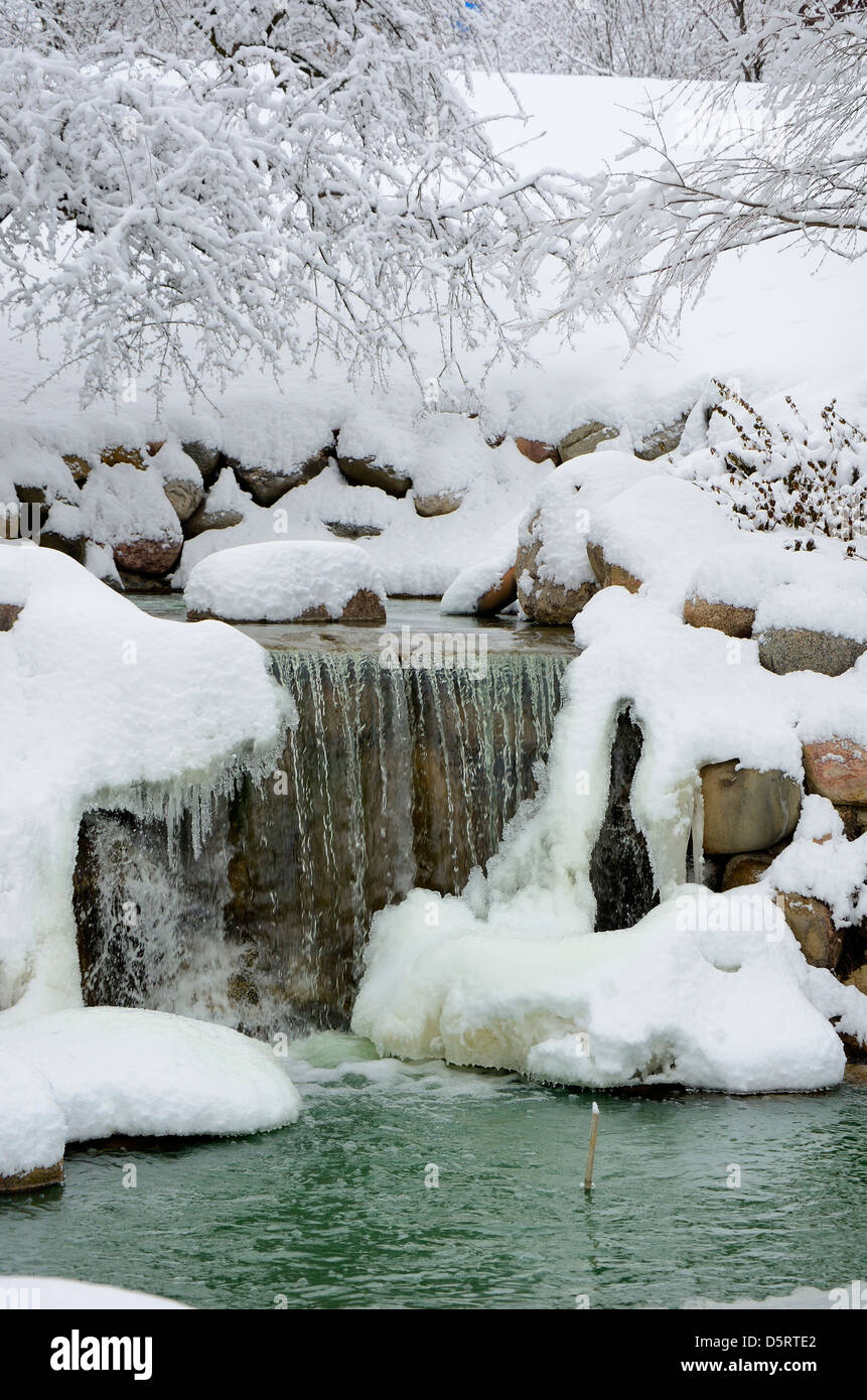 Snow covered waterfall Stock Photo - Alamy