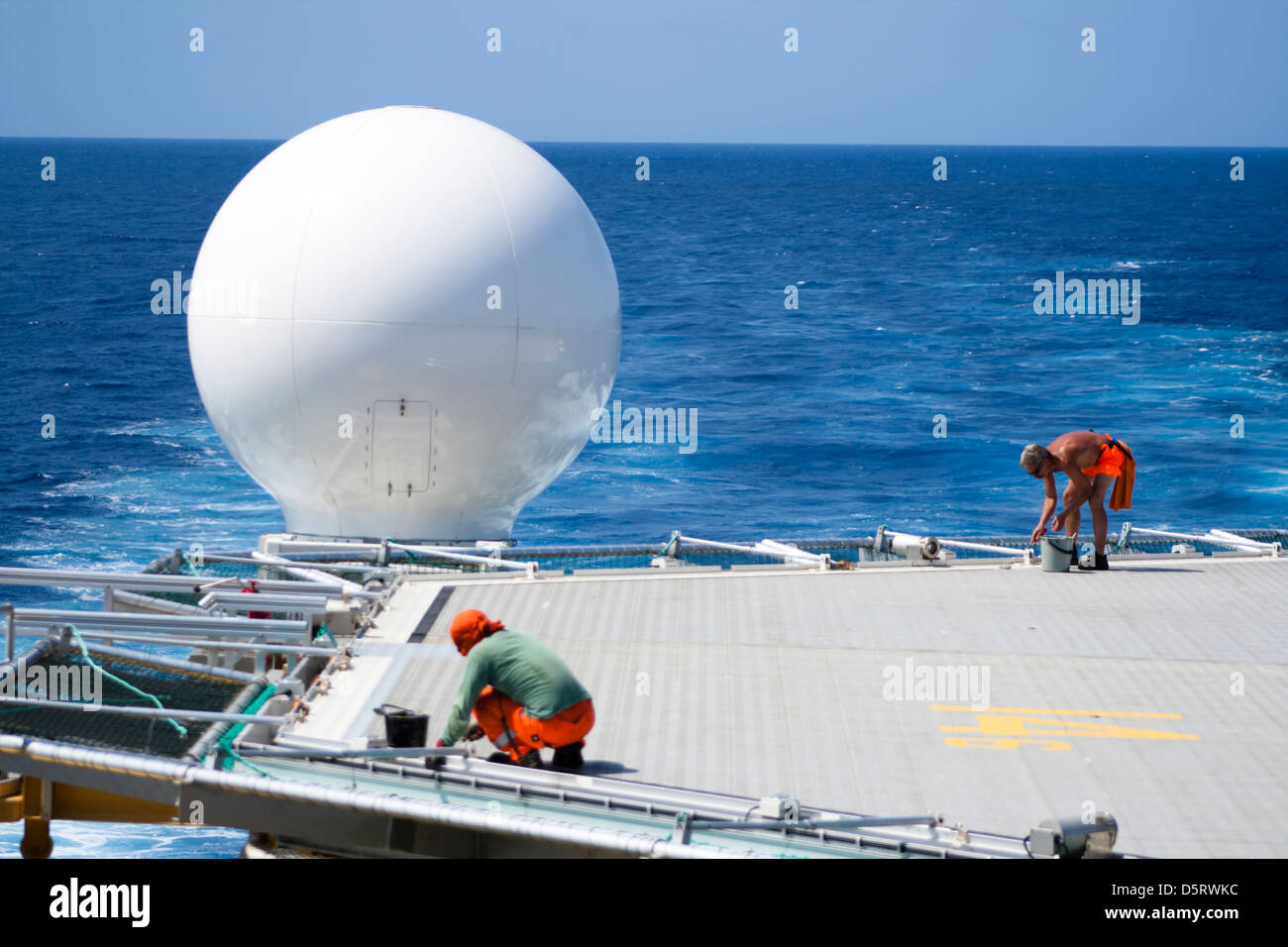 Seaman painting work at helicopter deck in Ramform Sovereign seismic ...