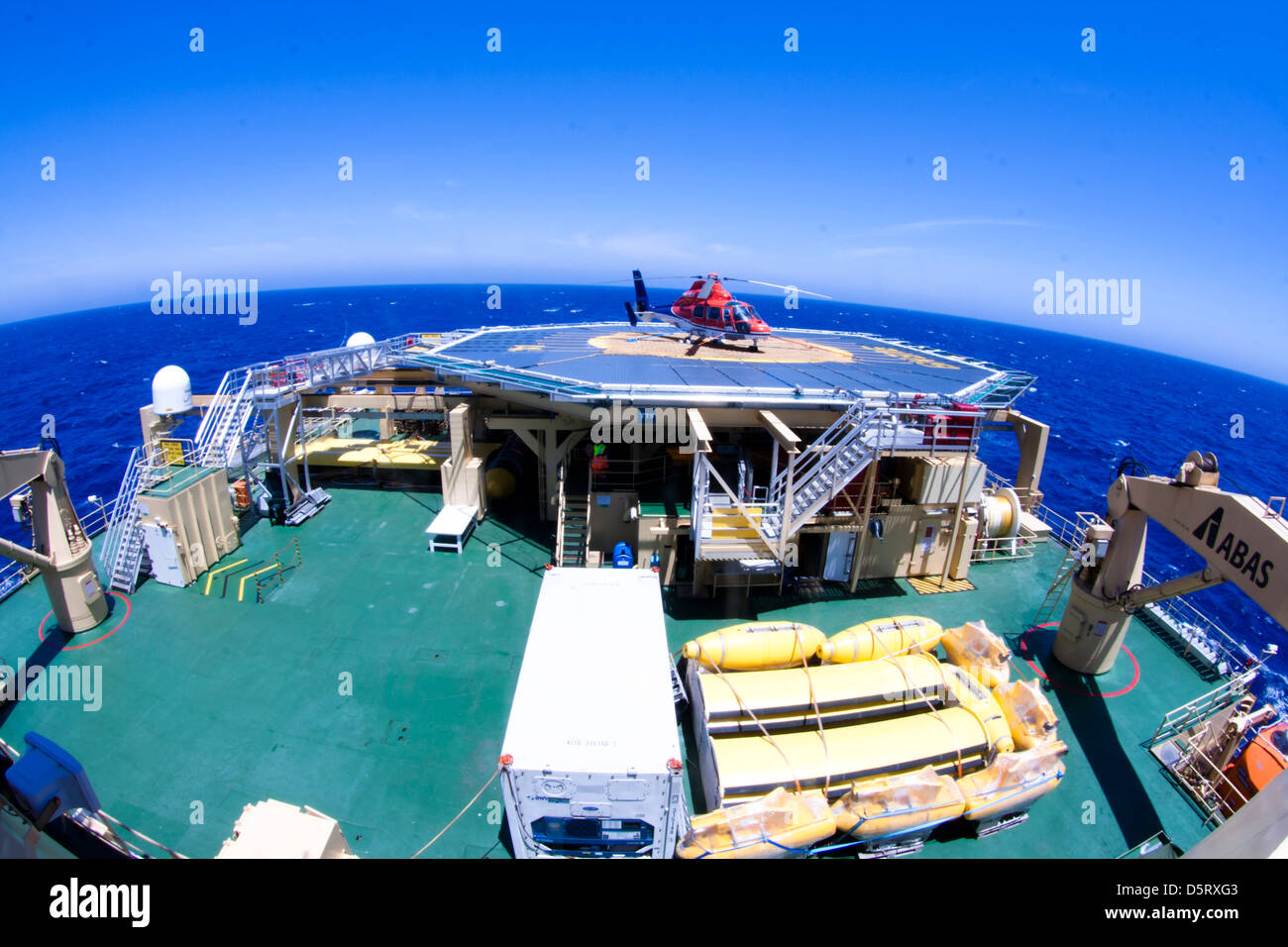 helicopter landed in the landing deck of seismic vessel Ramform ...